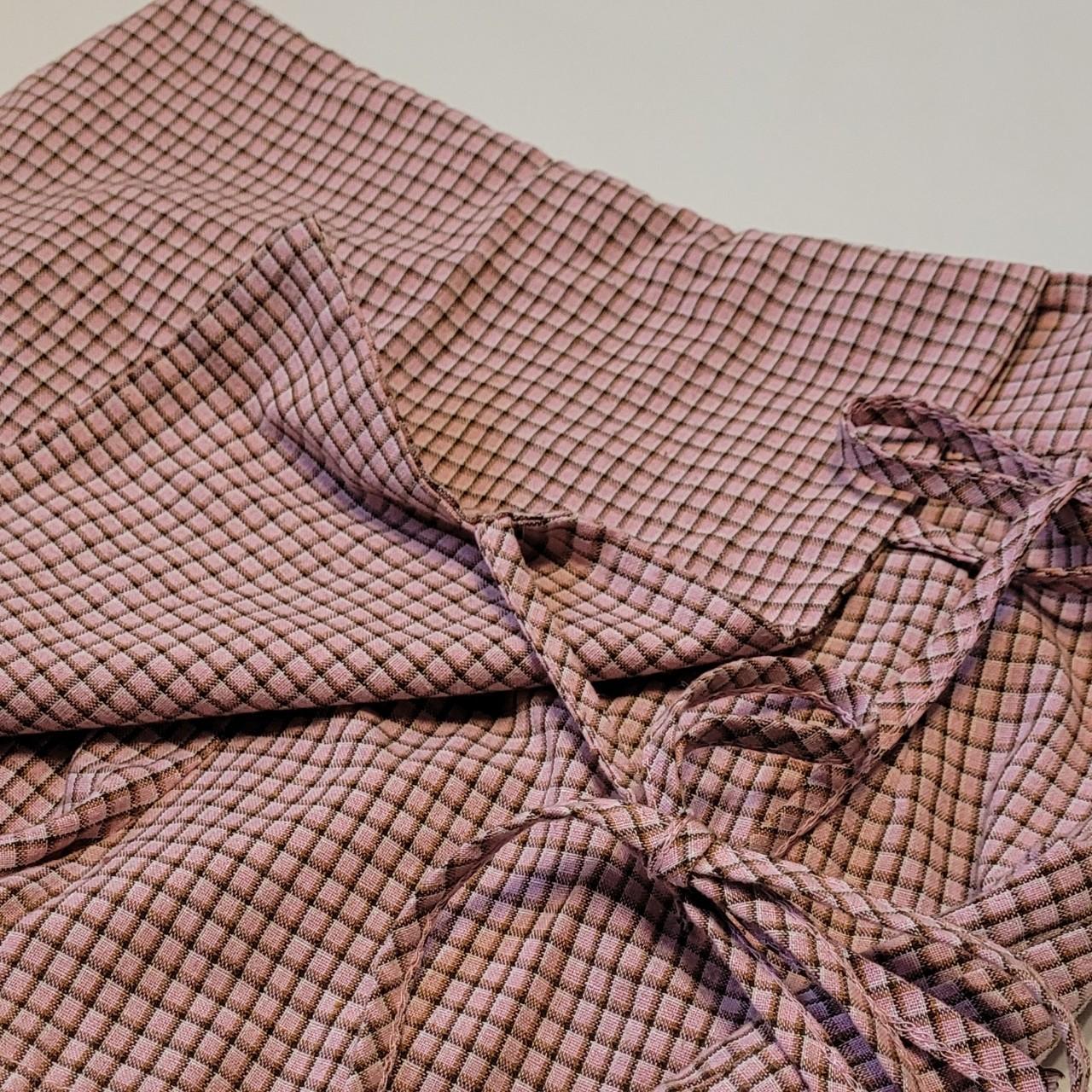 Cute pink skort with light brown squared pattern.... - Depop