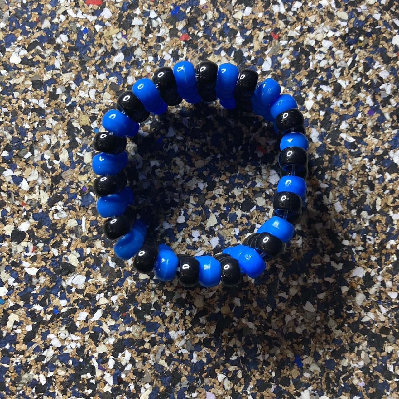 blue and black kandi cuff elastic is very thick so... - Depop