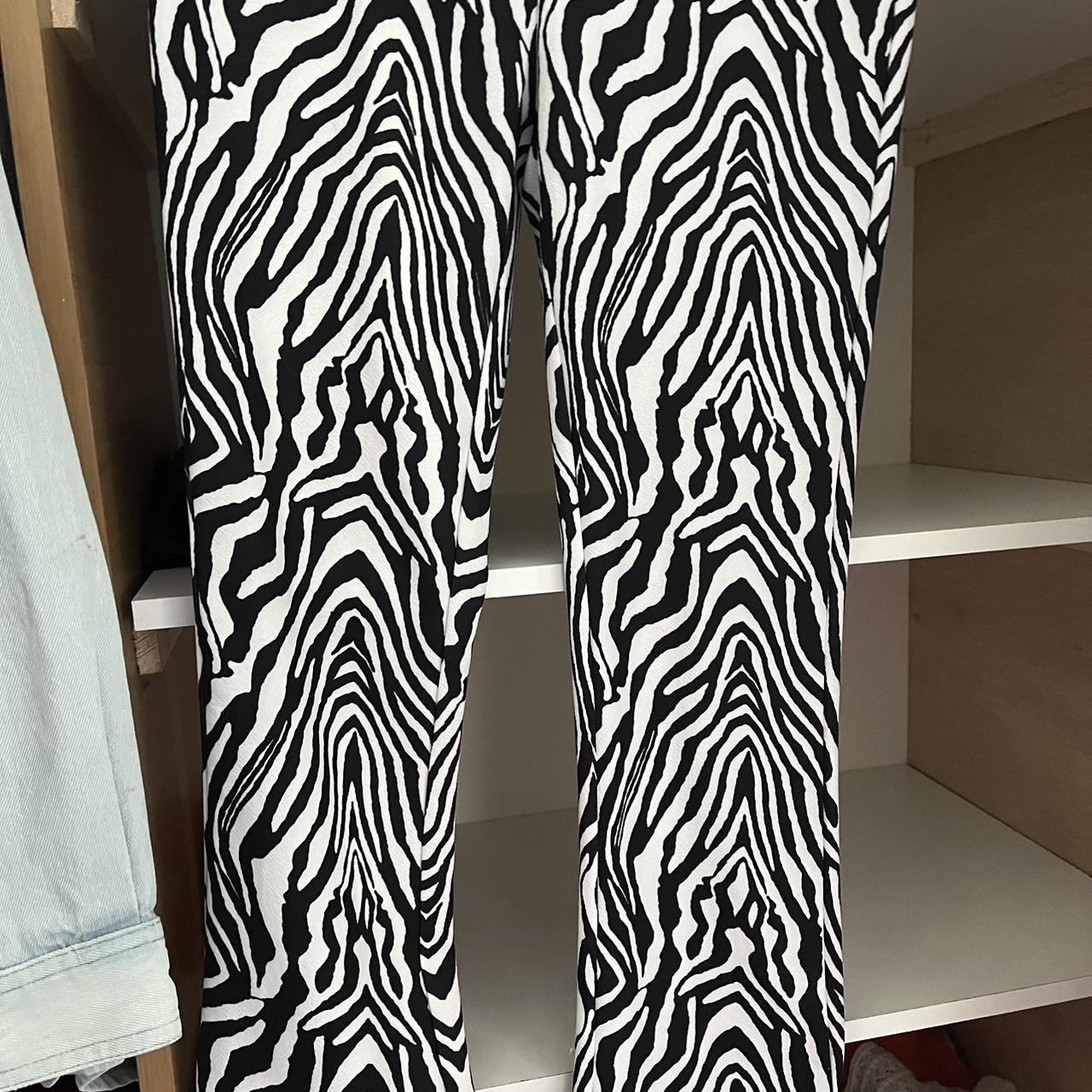 Zebra flares Not used much Size 8 Perfect condition... - Depop