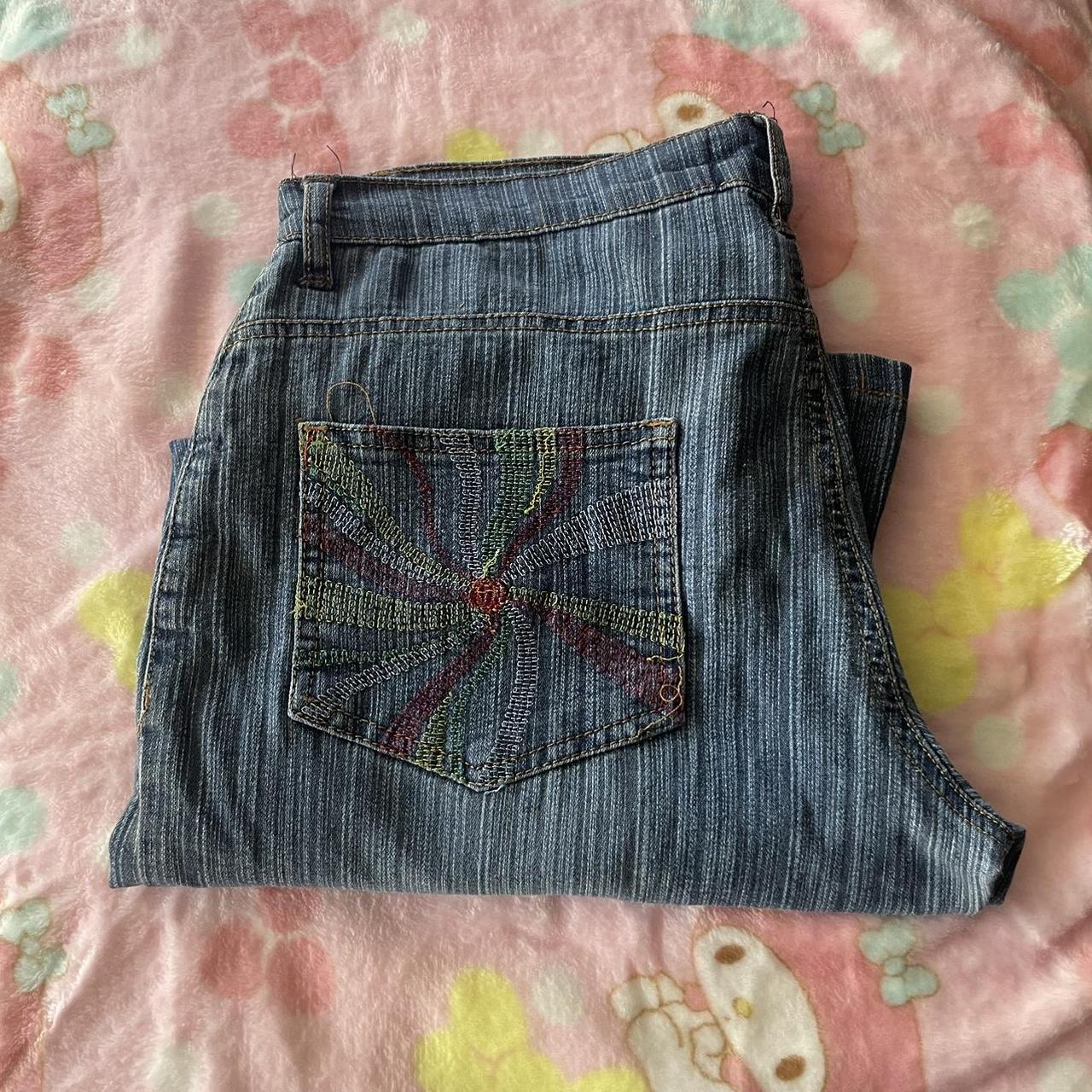Dark wash low rise flare jeans with embroidered... - Depop