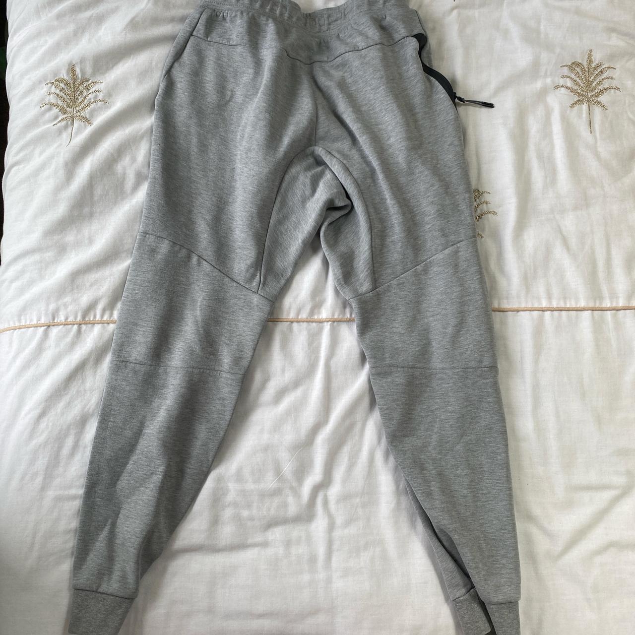 Grey Nike Tech fleece pants Men’s Small But will fit... - Depop