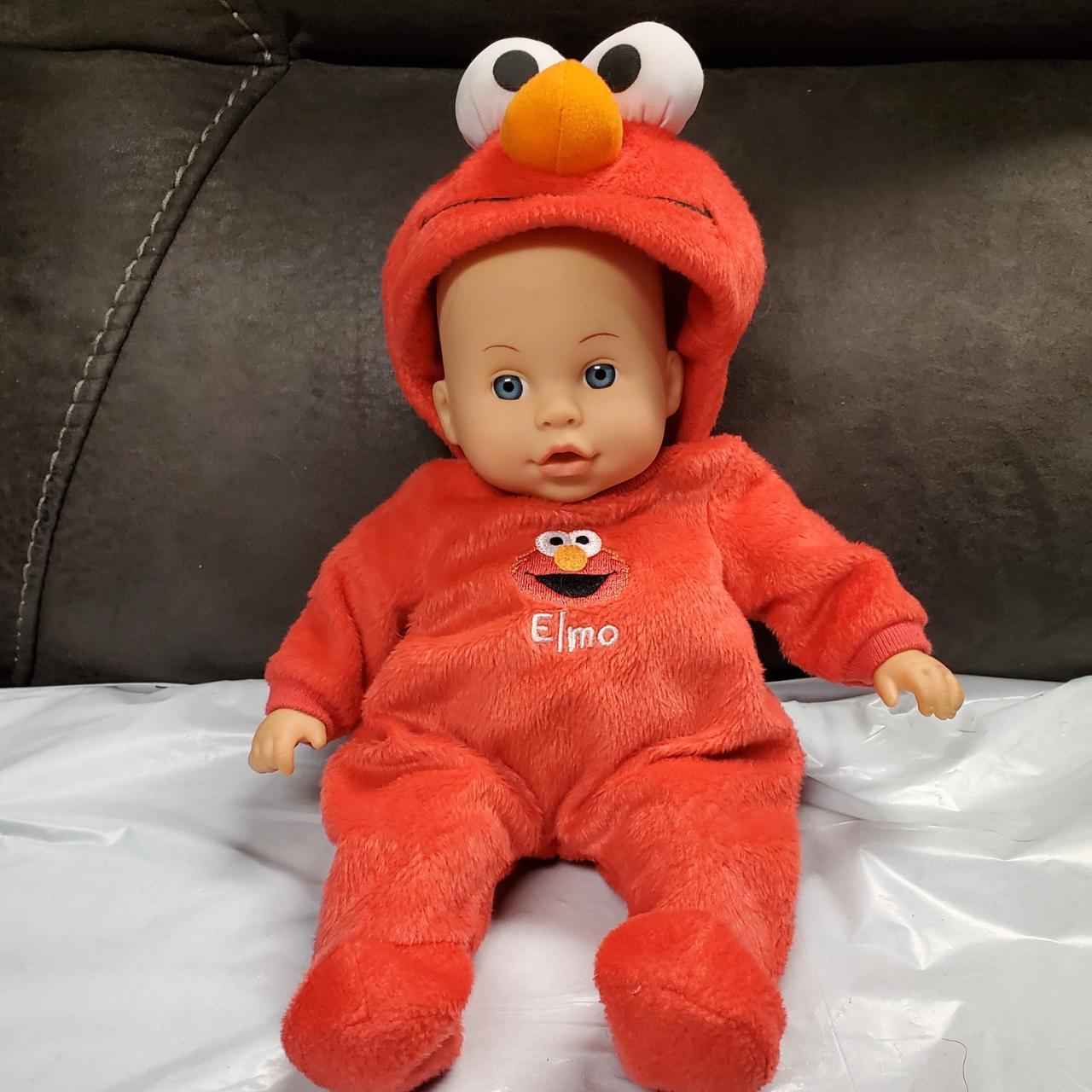 This adorable baby doll is dressed in a bright red... - Depop