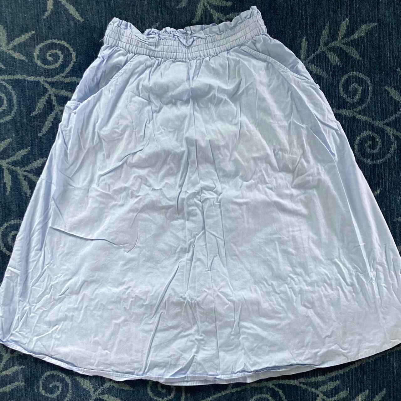 Light blue MONKI midi skirt with an elastic waist,... - Depop