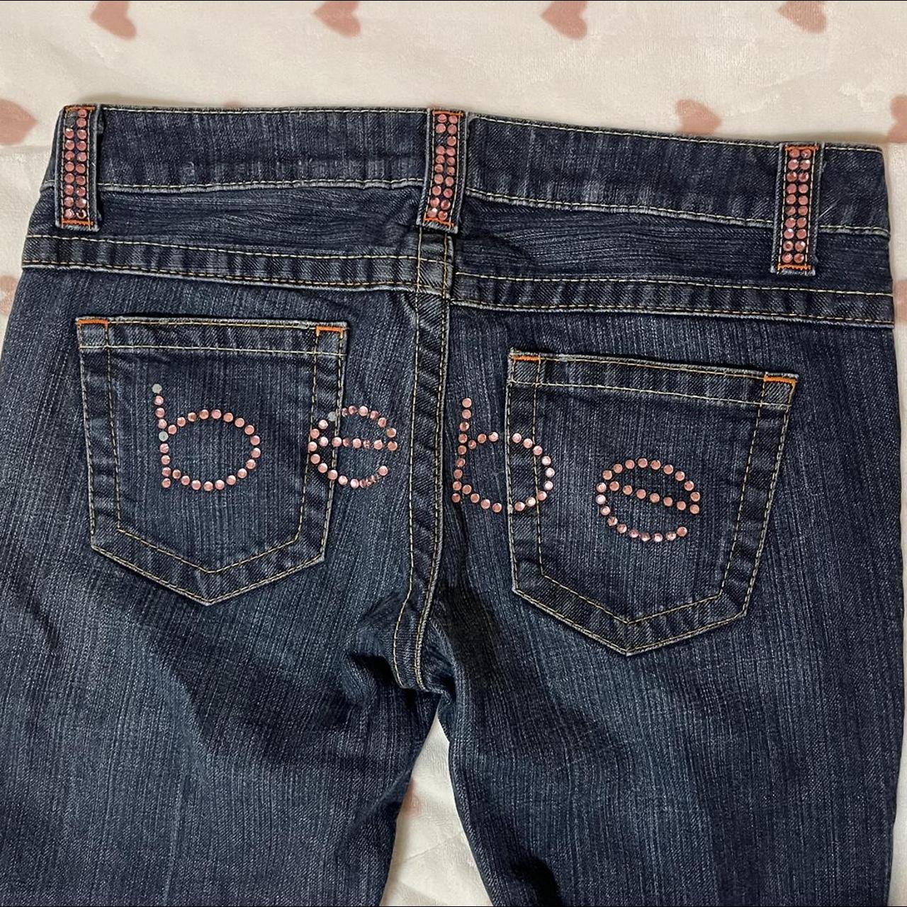 Bebe low rise flared jeans -bebe in pink rhinestones... - Depop