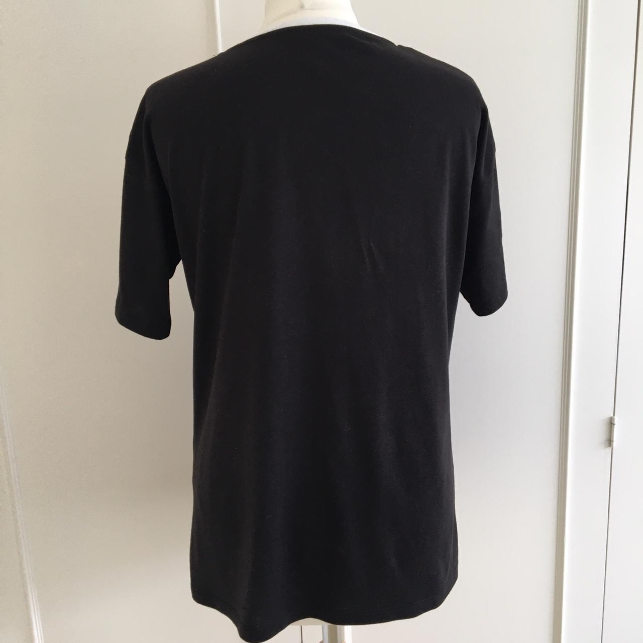 Simple black tee, white trim V neck. Never worn,... - Depop
