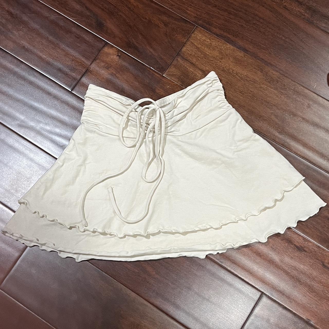 Cream ruffle skirt with tie in front Worn once - no... - Depop