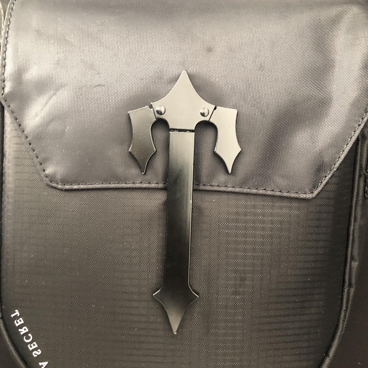 My brothers old trapstar bag but condition is... - Depop