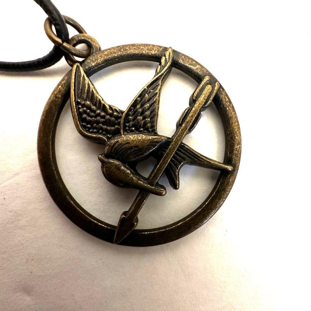 Lionsgate Hunger games mockingjay pendant... - Depop