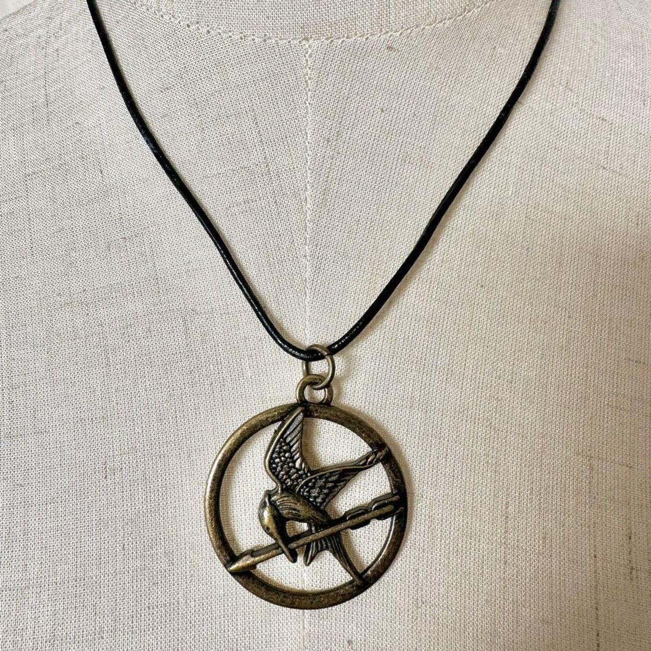 Lionsgate Hunger games mockingjay pendant... - Depop