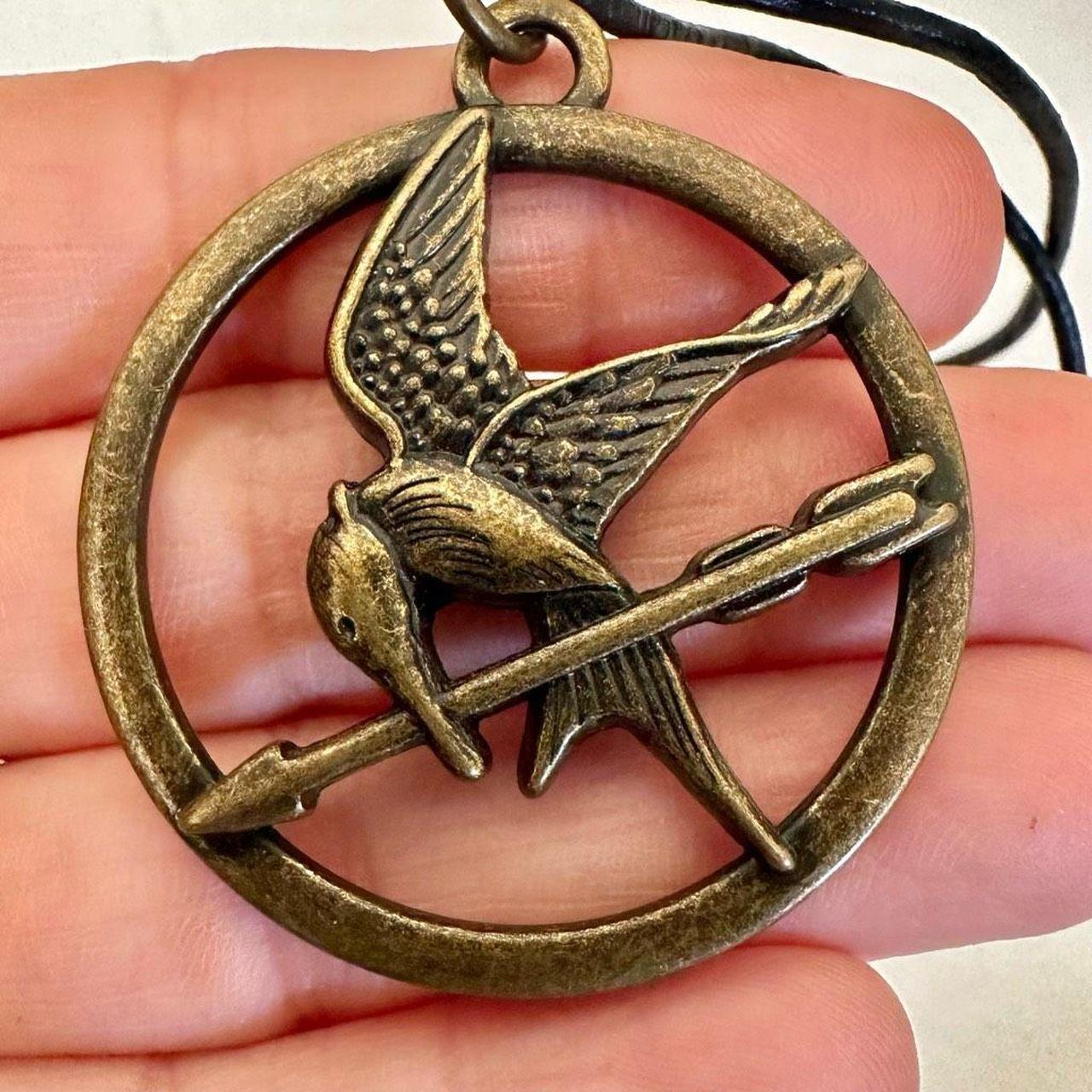 Lionsgate Hunger games mockingjay pendant... - Depop