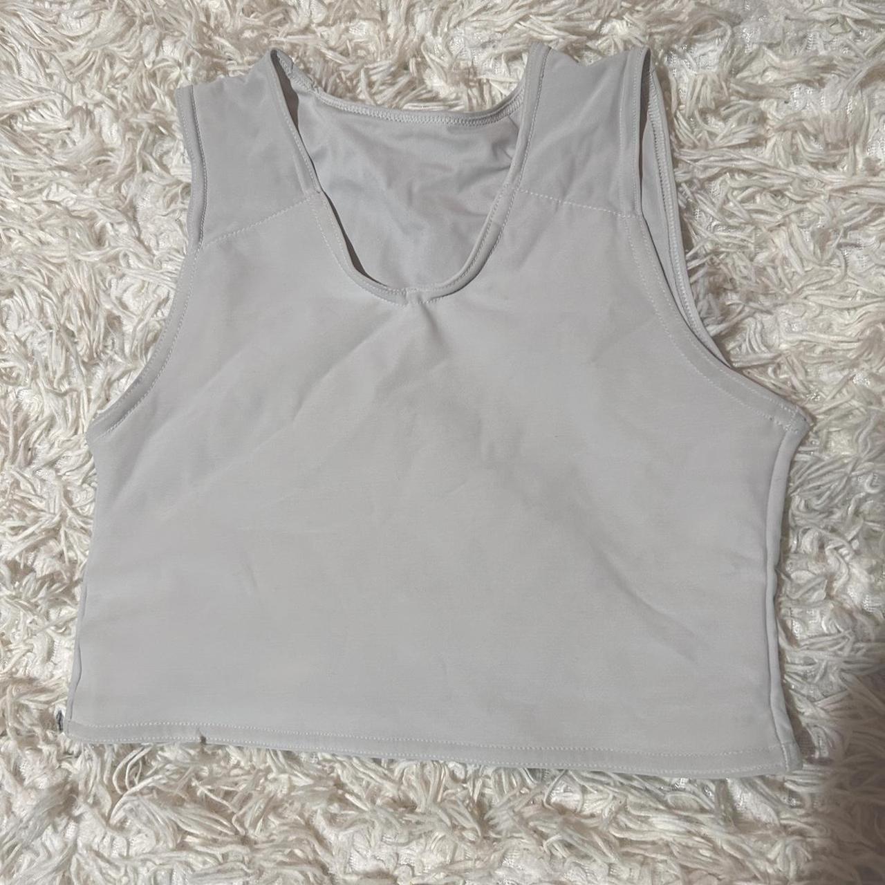 white chest binder, fits size small. very high... - Depop