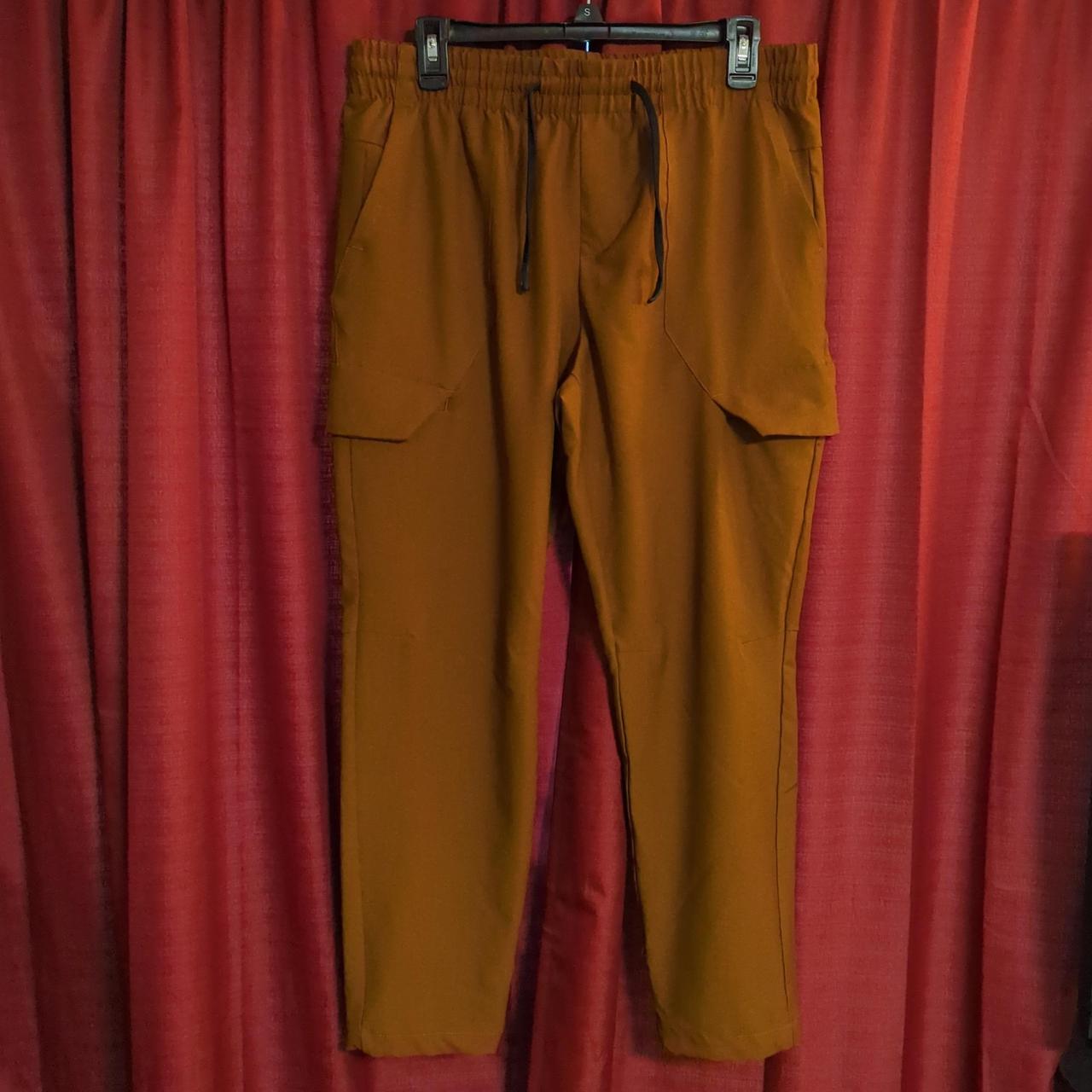 Stretchy burnt orange FLX cargo pants. - Depop
