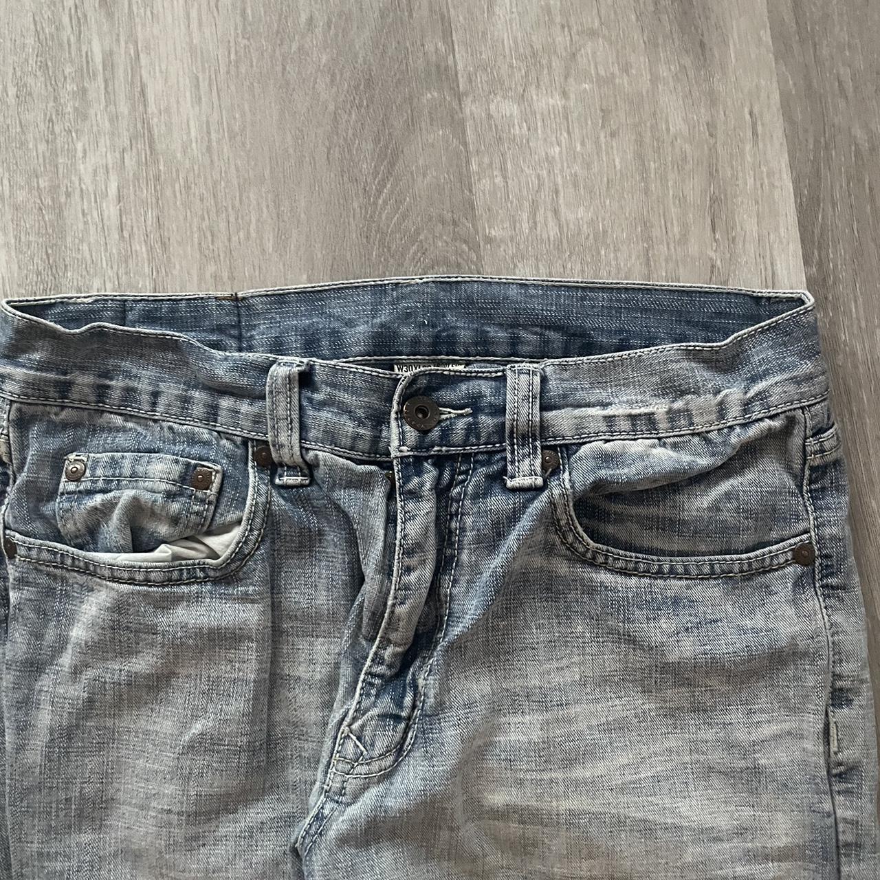 light wash flared flypaper jeans with embroidered... - Depop