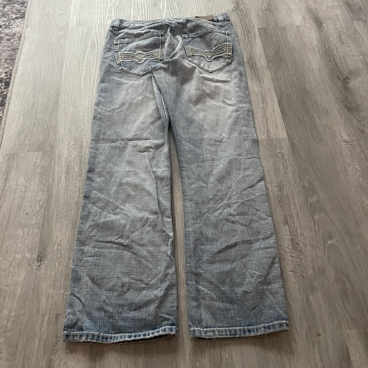 light wash flared flypaper jeans with embroidered... - Depop