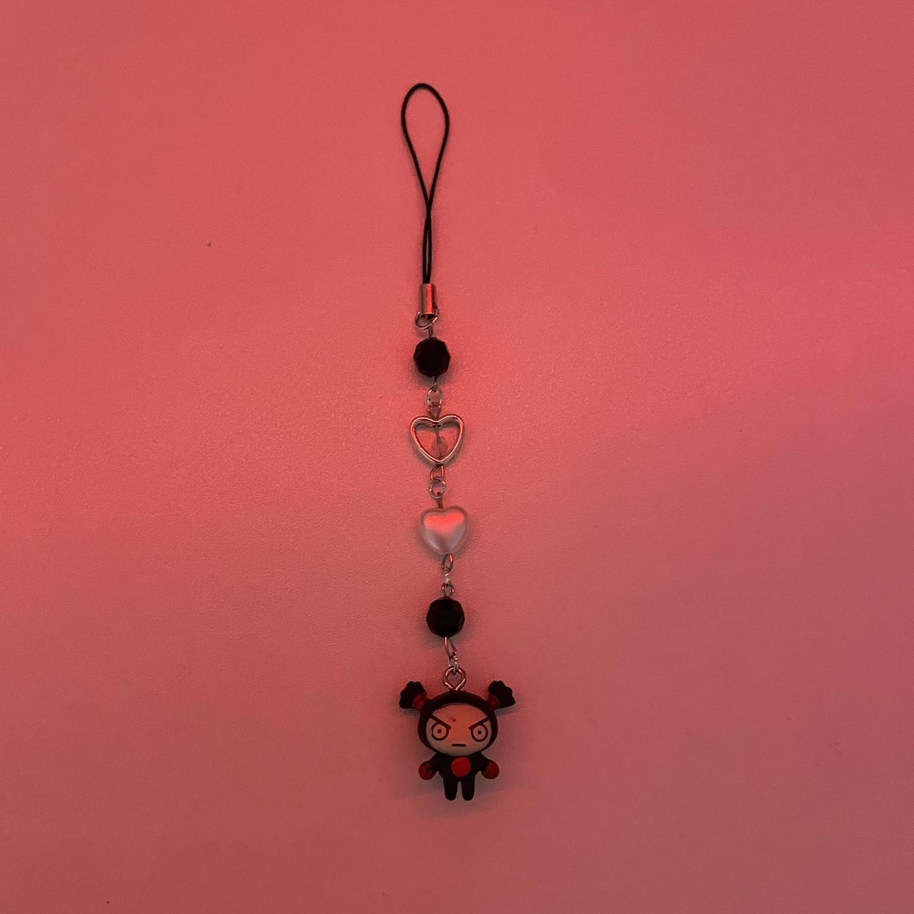 ONLY GARU PHONE CHARM !!! I sold the other pucca... - Depop