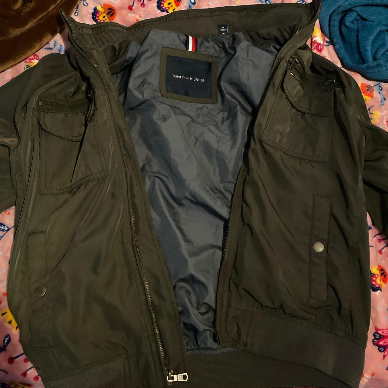 Black Heavy Tommy Hilfiger jacket Glossy look to it... - Depop