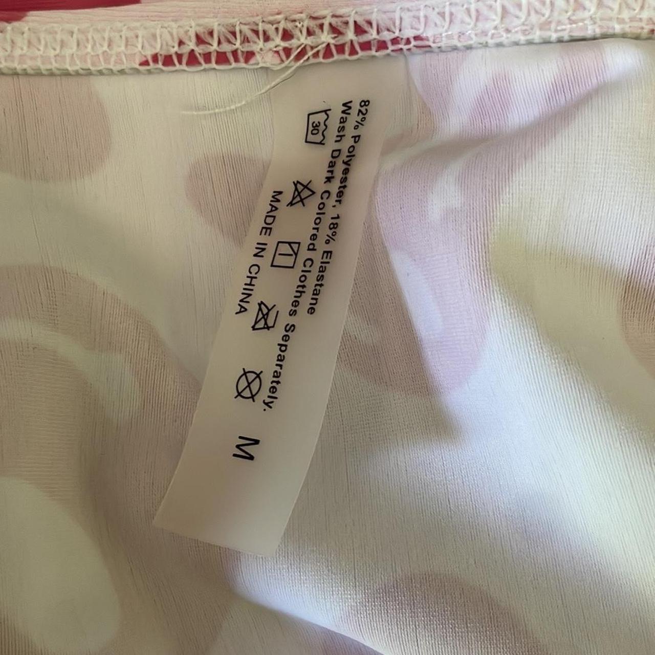 Dive into style with this vibrant pink melted smiley... | Depop