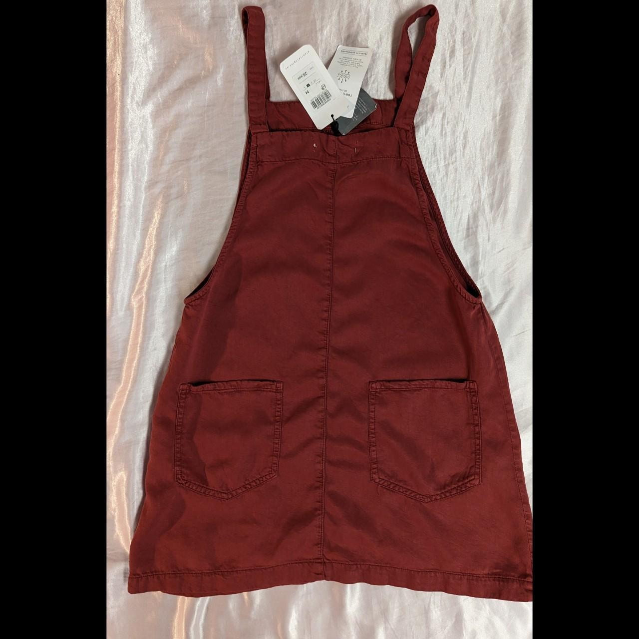Maroon overall mini dress. Brand New, tags still... - Depop