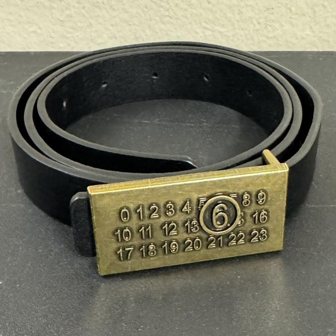 Mm6 Circle 6 ° black leather with gold buckle belt... | Depop