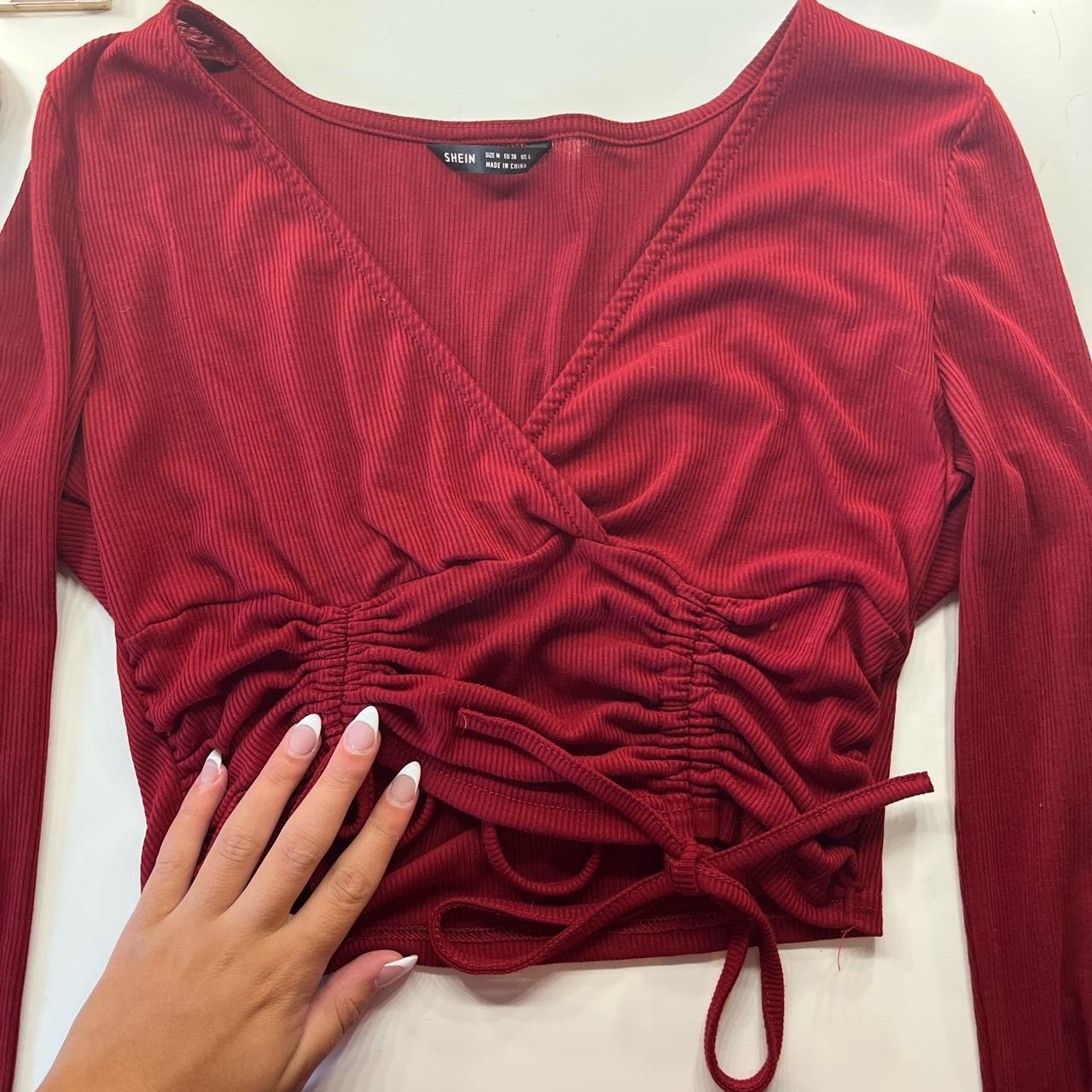 red long sleeve top that ties in the front - can fit... - Depop
