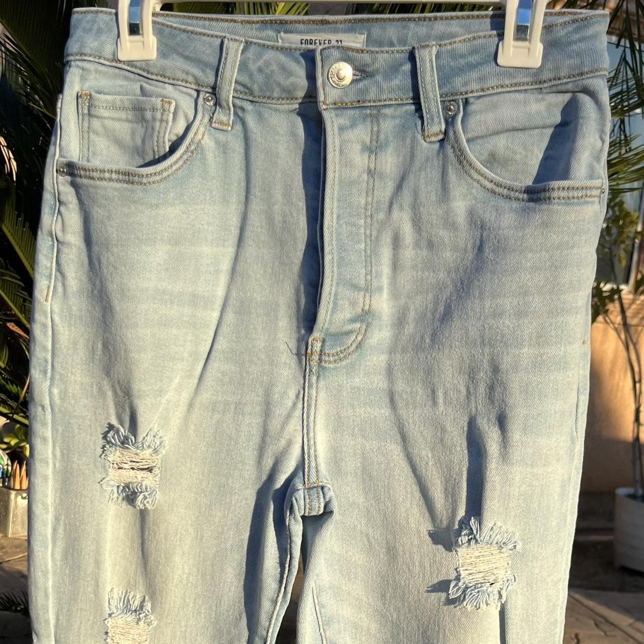 Light blue jeans with small rips. Button up jeans.... - Depop