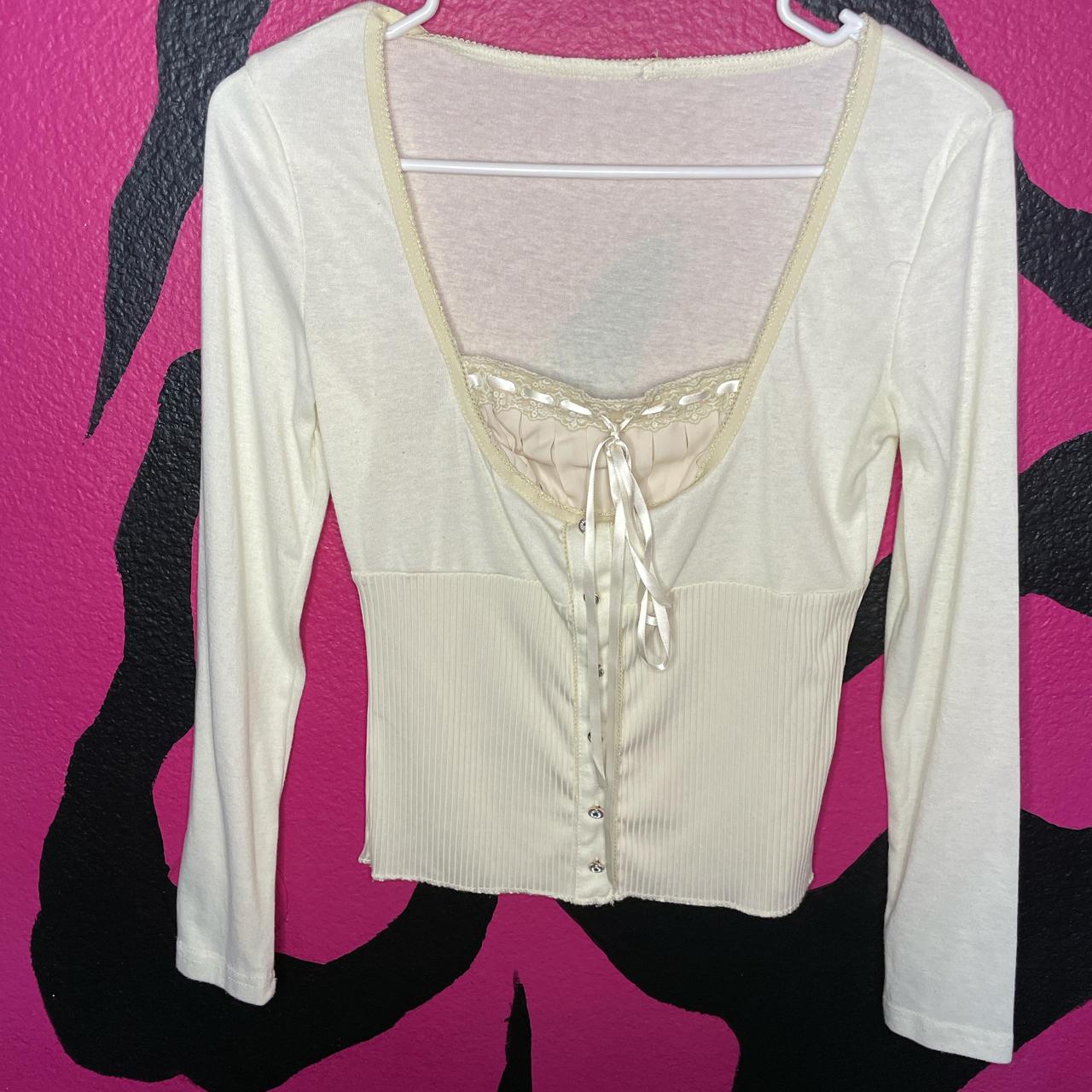 Cream and white cropped long sleeve top with lace up... - Depop