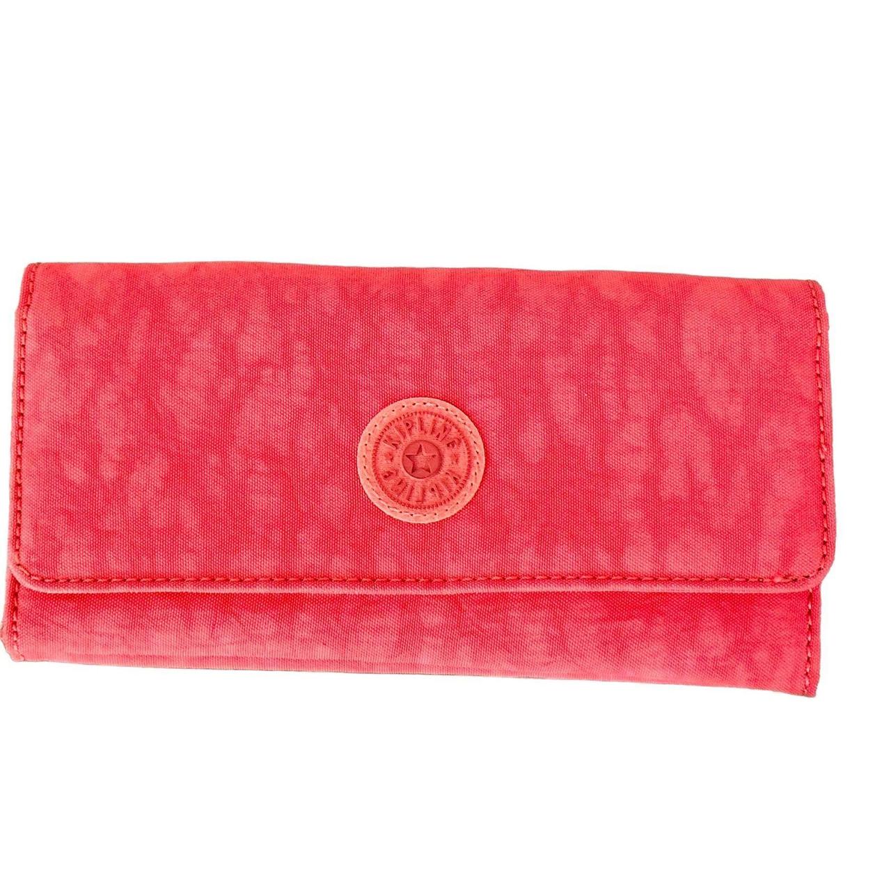 New without tags, salmon color Kipling wallet. $42... - Depop