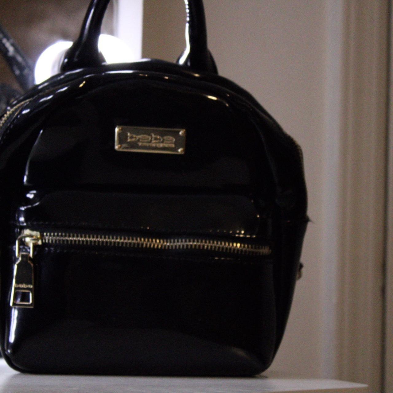 Bebe Women's Black and Gold Bag | Depop