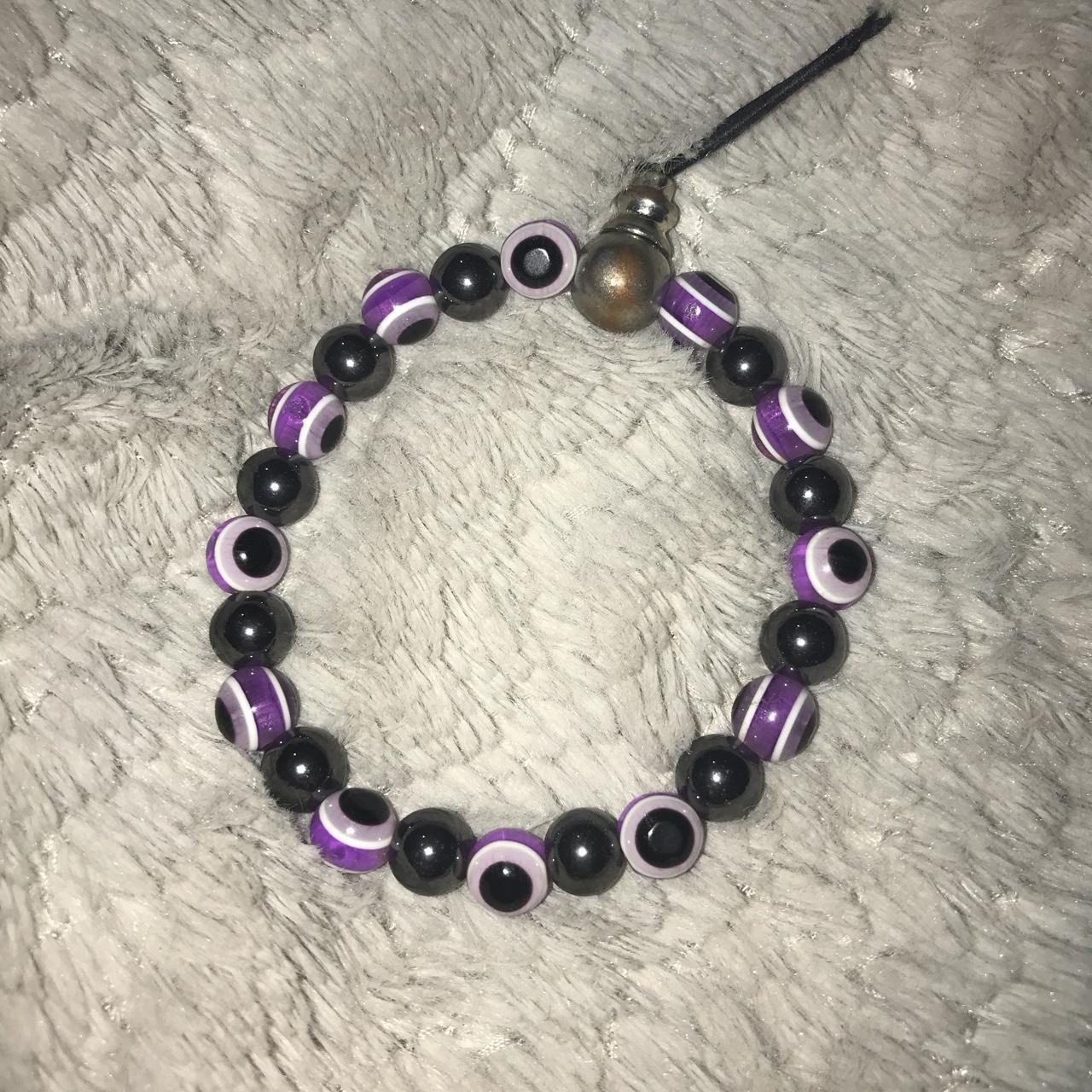 Purple evil eye bracelet •worn a few times, one... - Depop