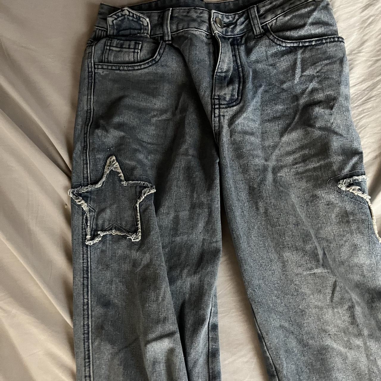 Bluish grey jeans with stars on them. Fits very nice... - Depop