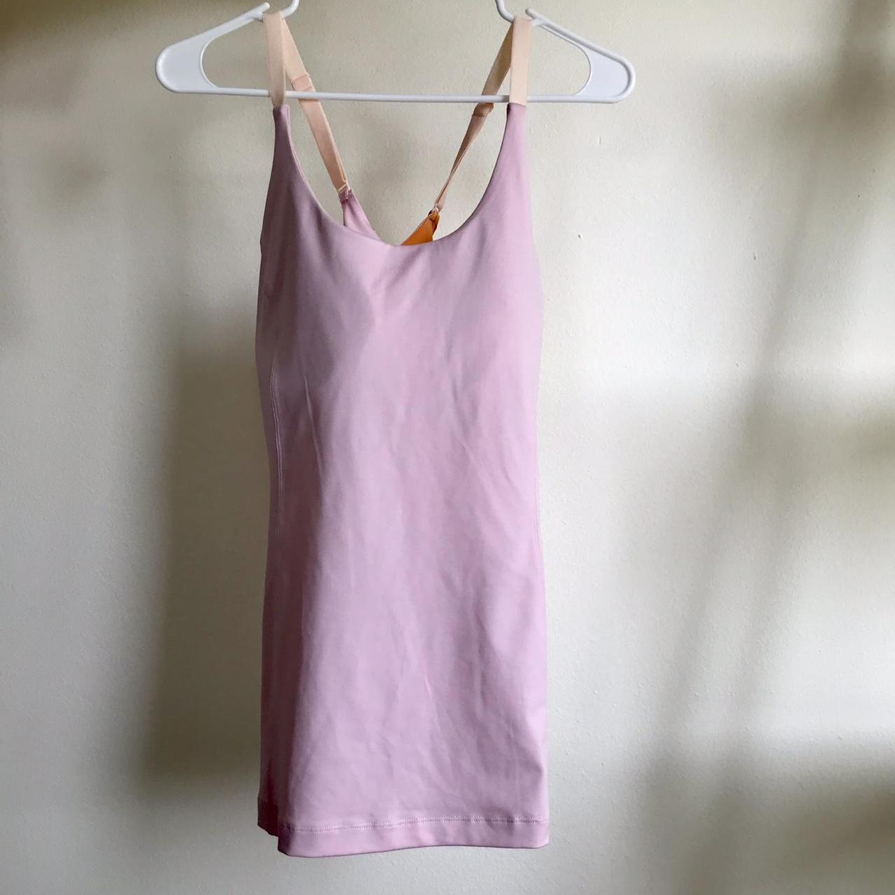 Pink workout tank top. Has crisscross straps and... - Depop