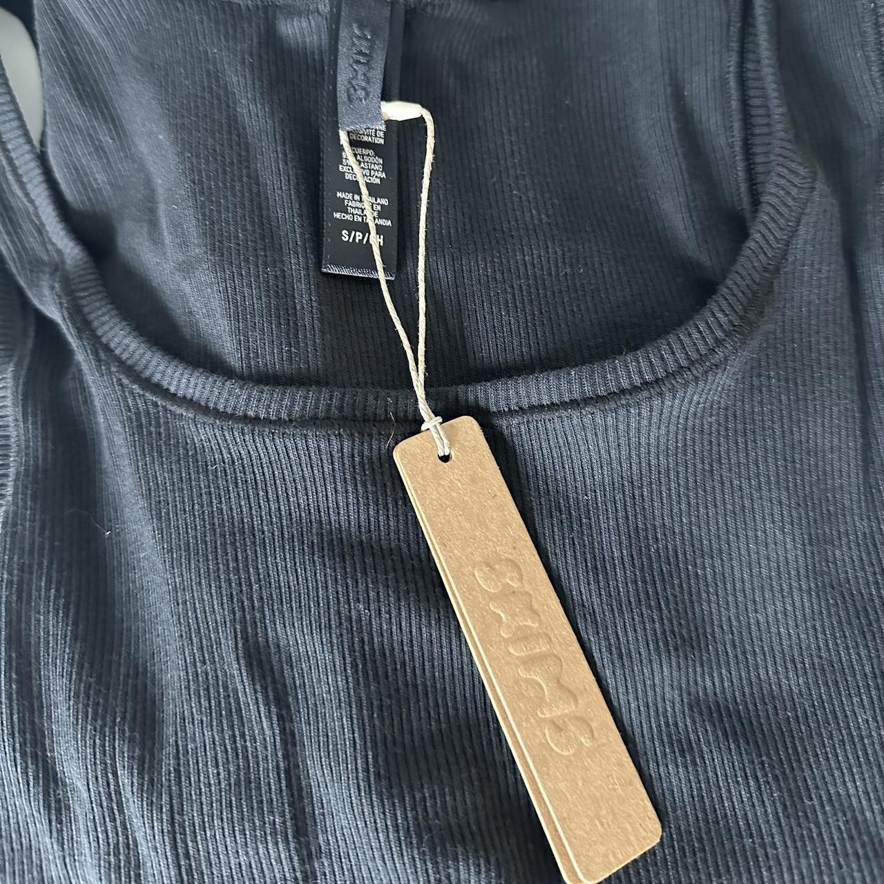 Brand new skims tank 🖤 Super cute and stylish... - Depop