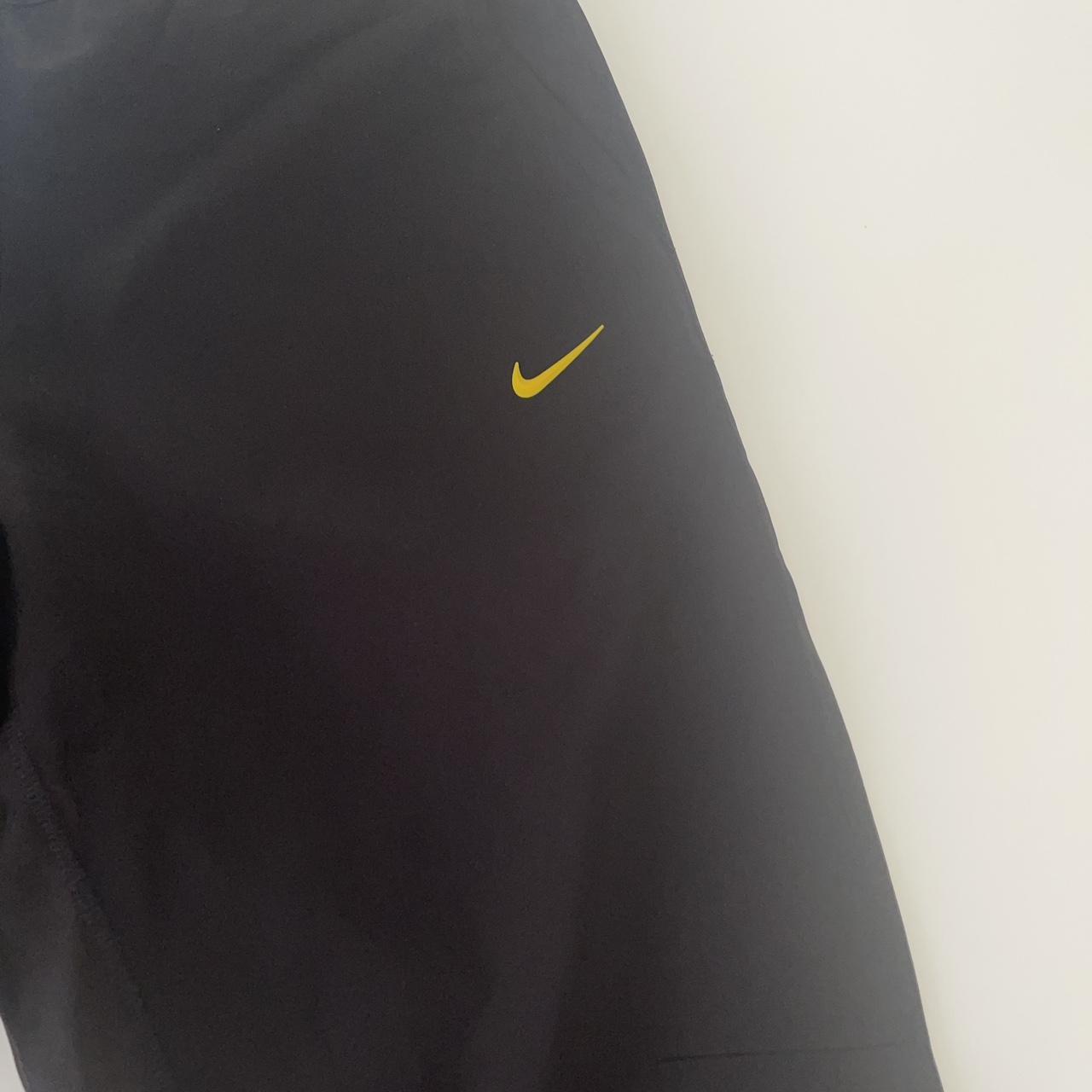 NOCTA x TECH FLEECE PANTS (BLACK and YELLOW) - Depop