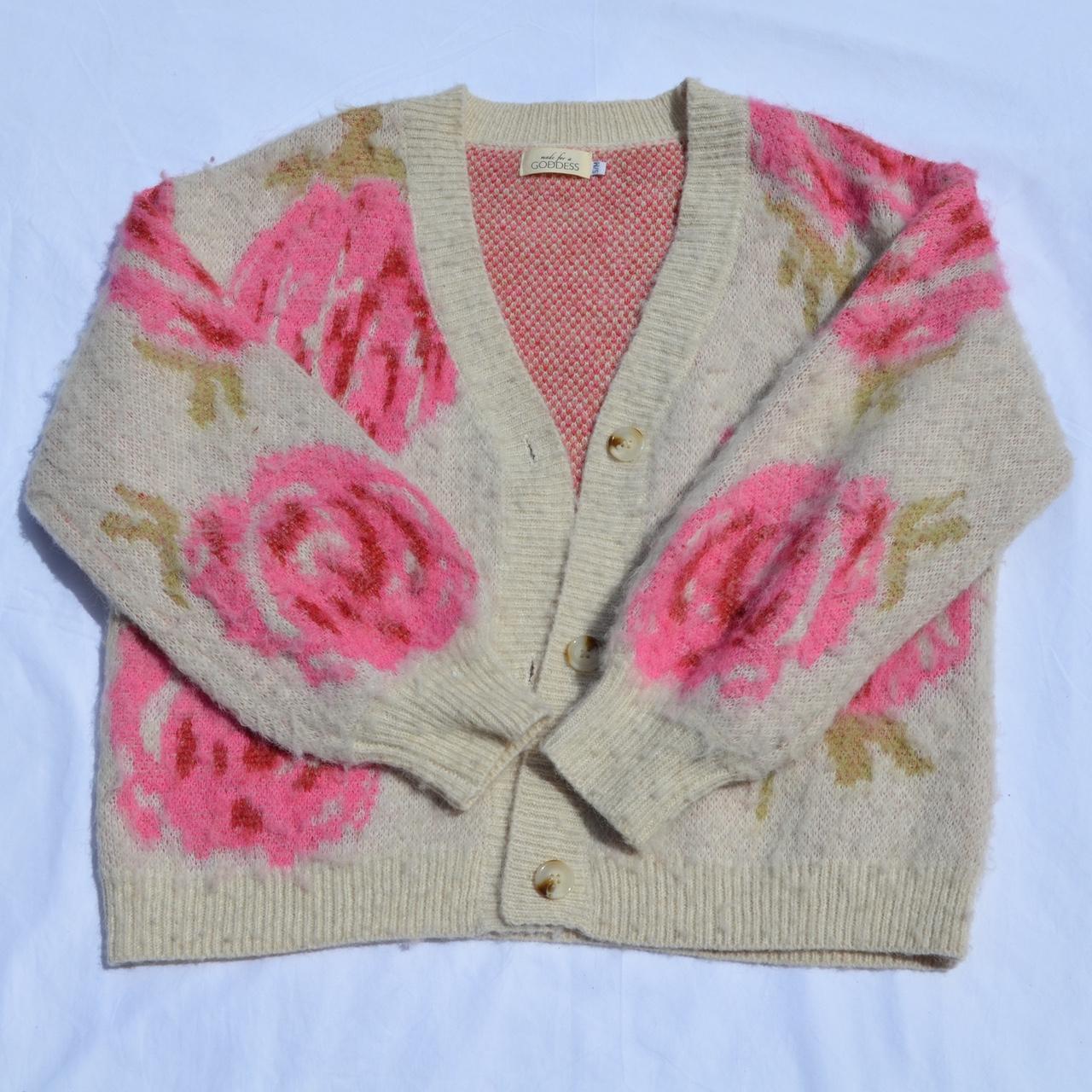Oversized rose-print cardigan. This cozy piece is... - Depop