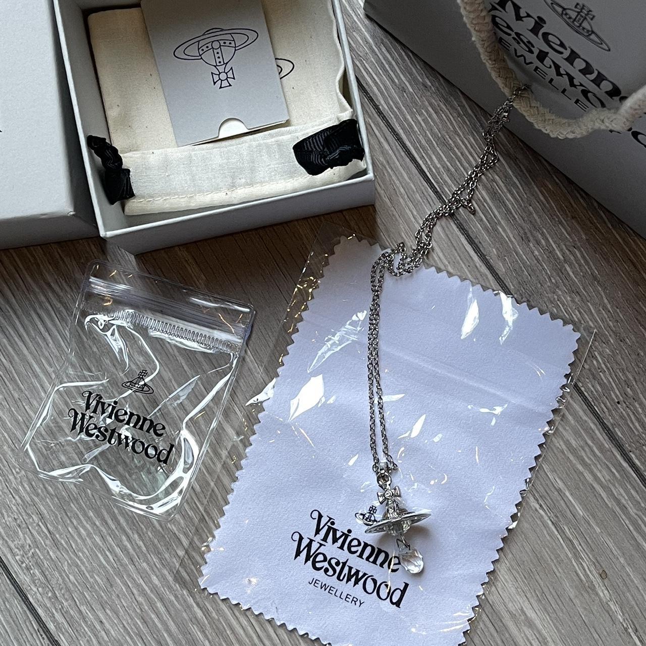 Transparent crystal sphere with a teardrop-shaped... - Depop