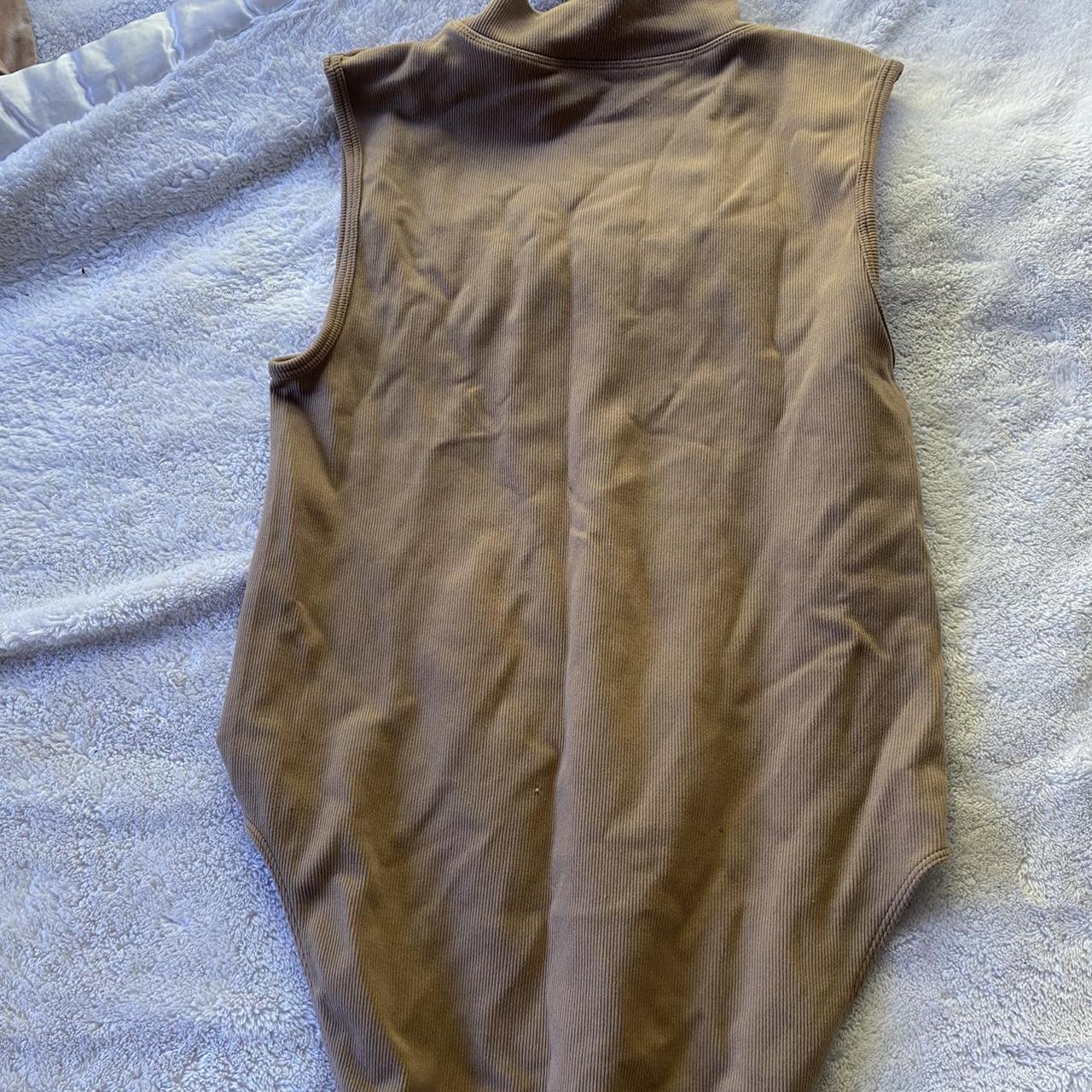 A little bit of Pailing Tan body suit Brand... - Depop