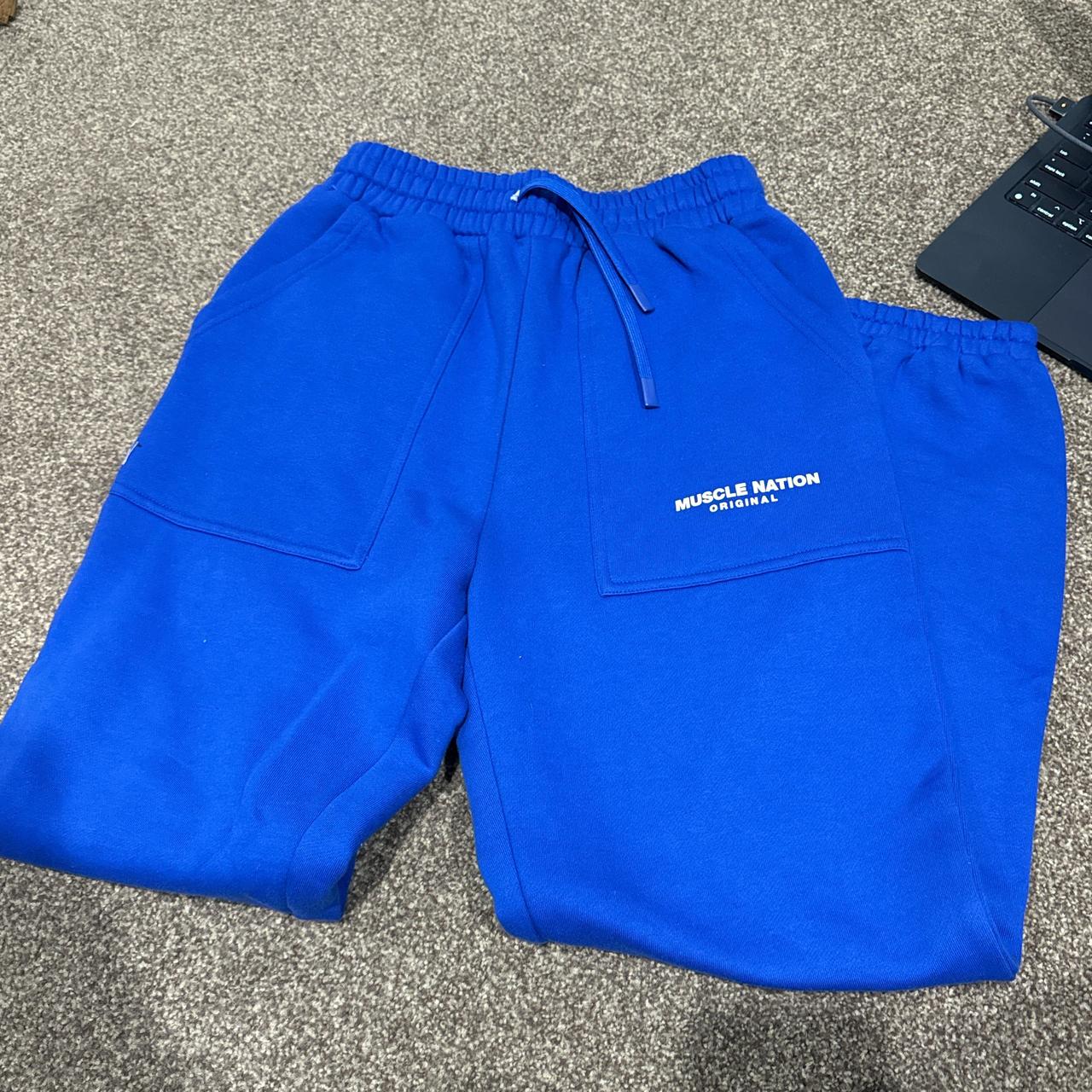 Blue muscle nation trackies brand new Size small - Depop