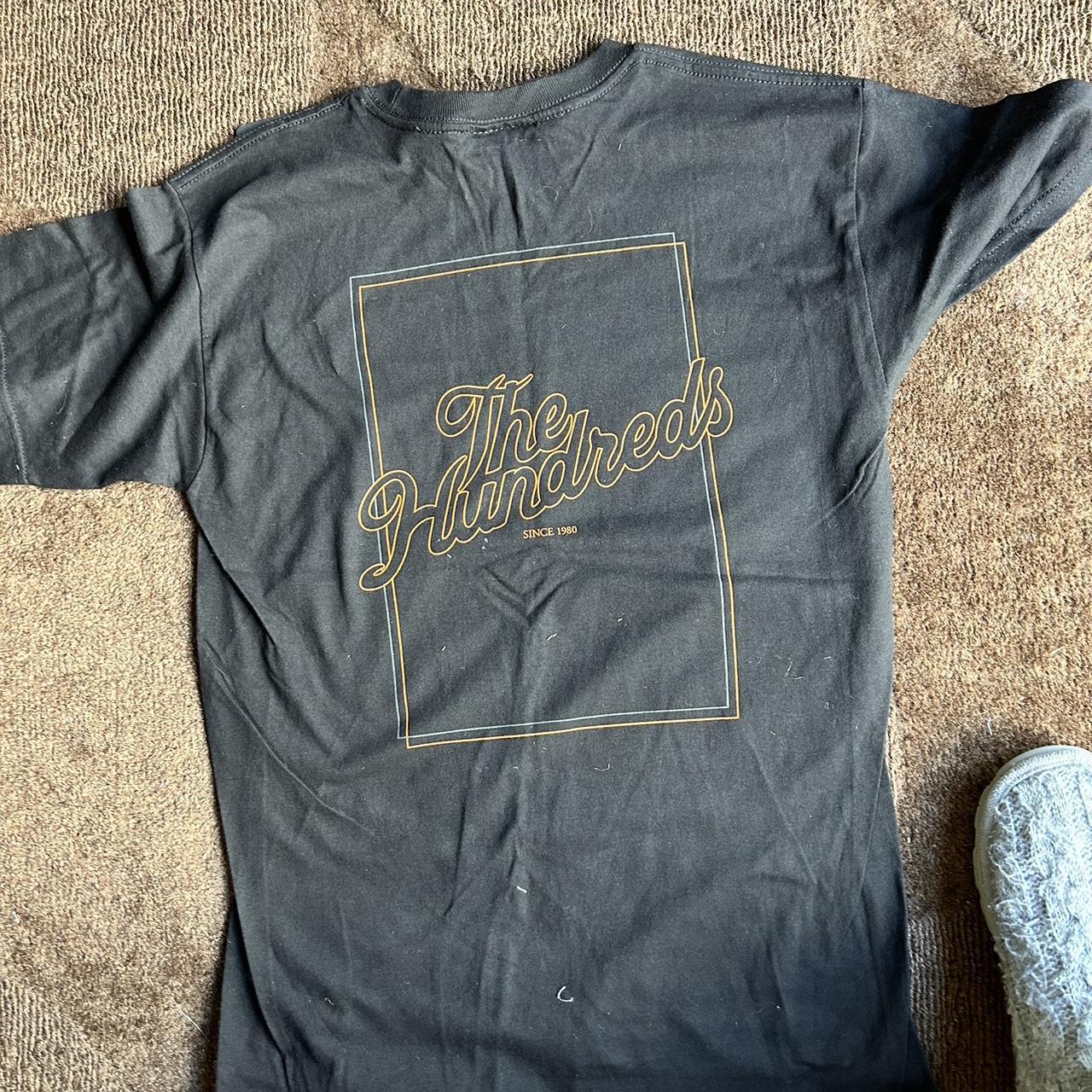 Hundreds T-shirt - black tee with orange bomb on... - Depop