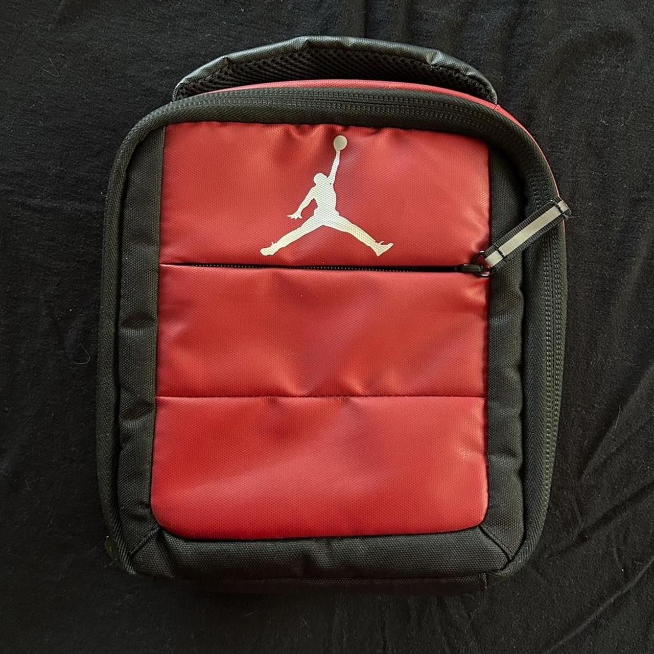 listed is a Michael Jordan black and red lunchbox... - Depop