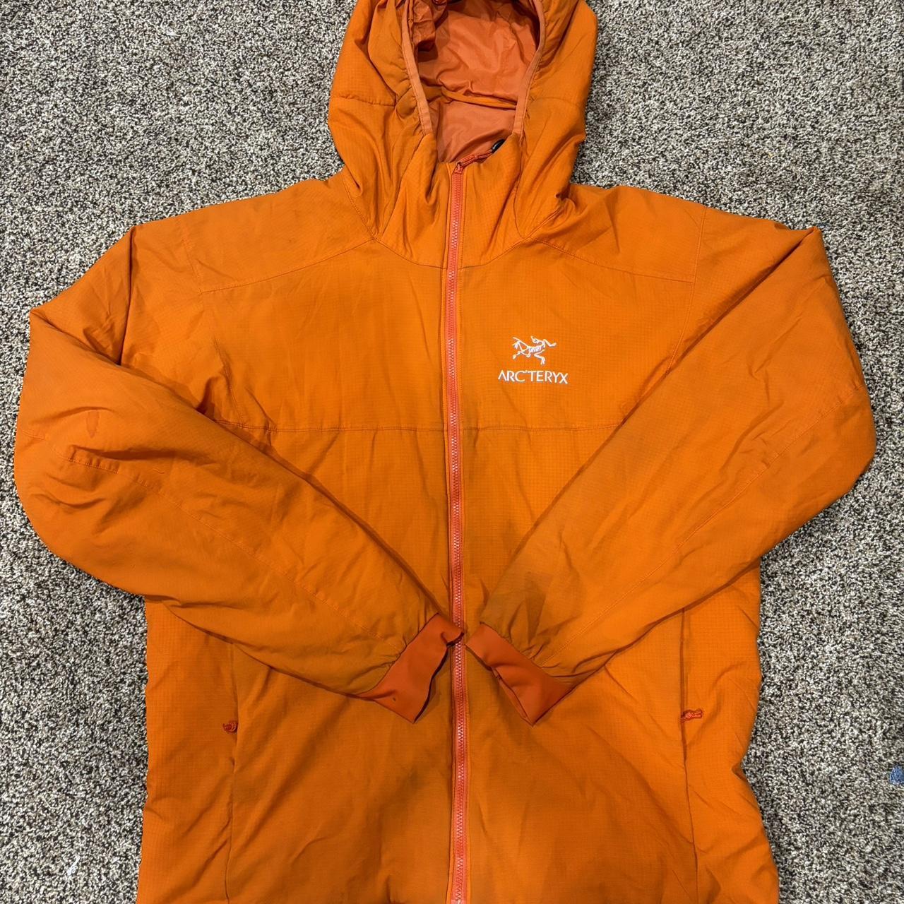 Orange Arc’teryx Nuclei Puffer worn, small stain... - Depop