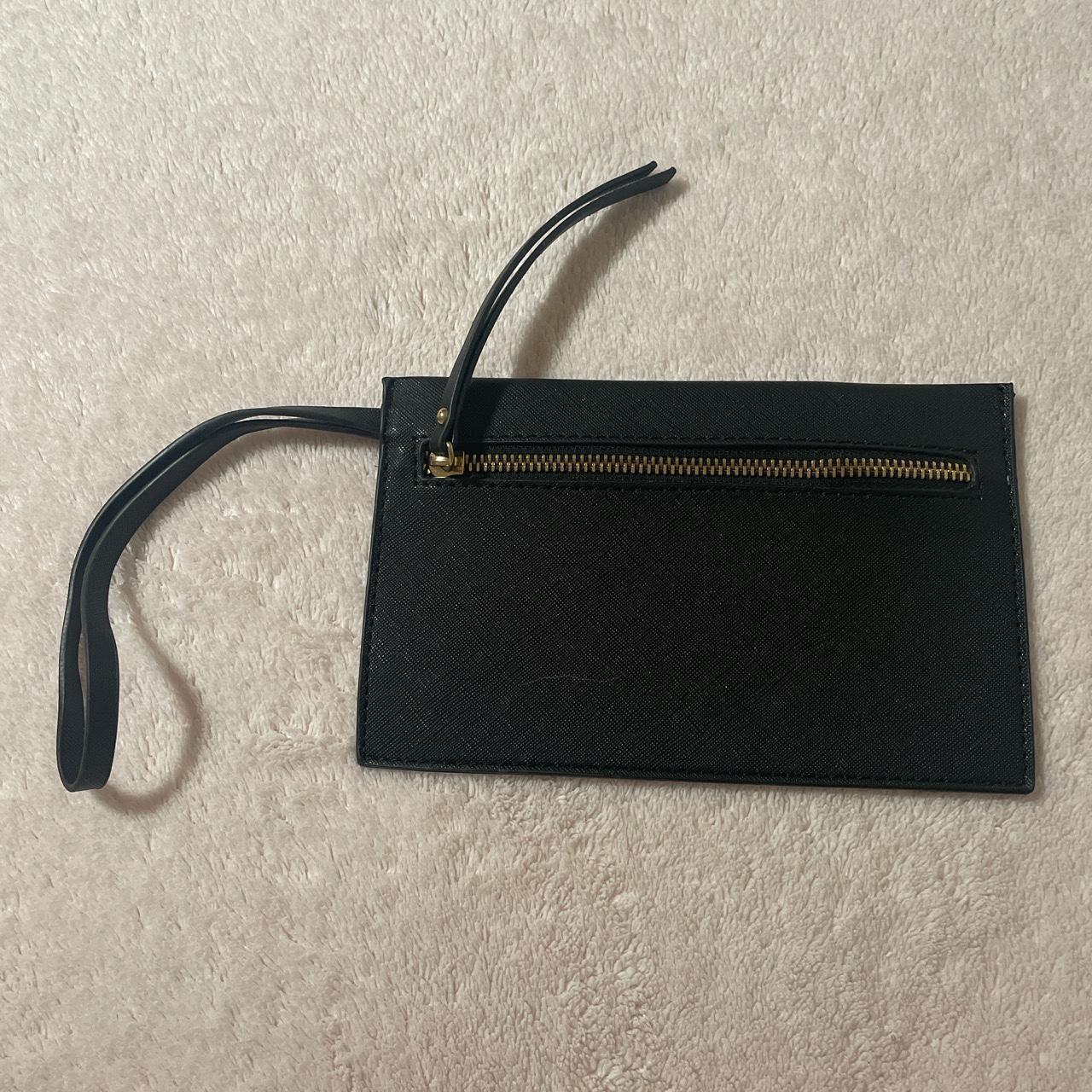 Small black pouch with attached wristband. Came as a... - Depop
