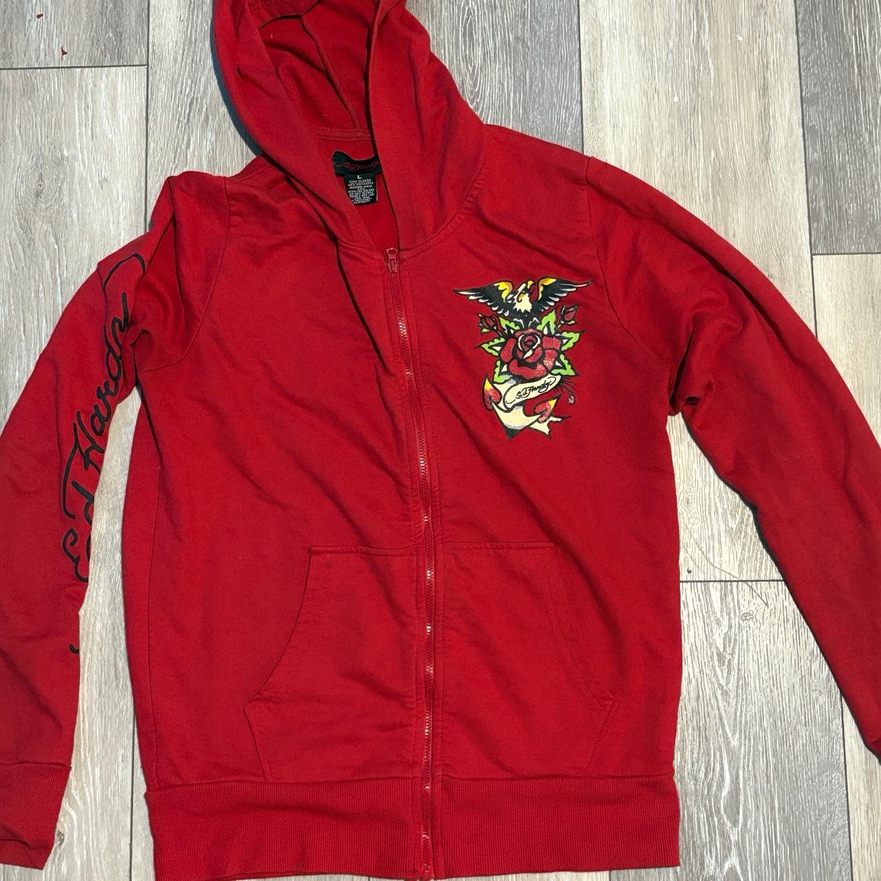 Red Ed Hardy zip-up hoodie with a bold design... | Depop