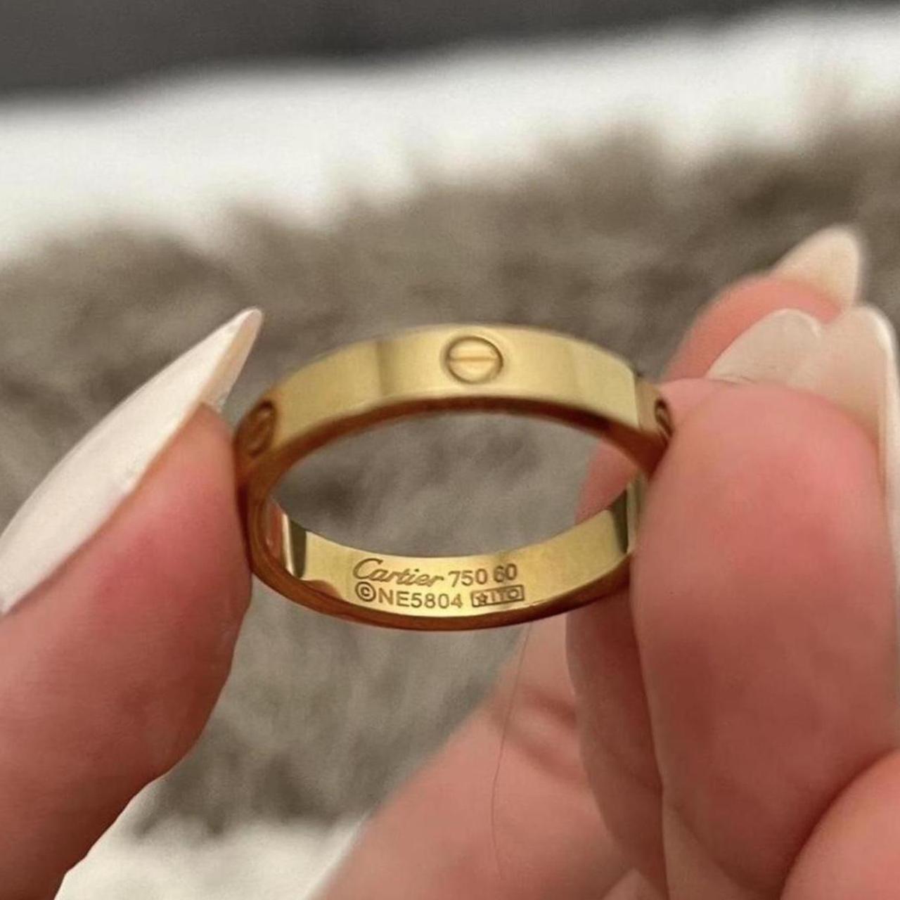 Gold Cartier ring size 8. Has a couple of scratches... - Depop