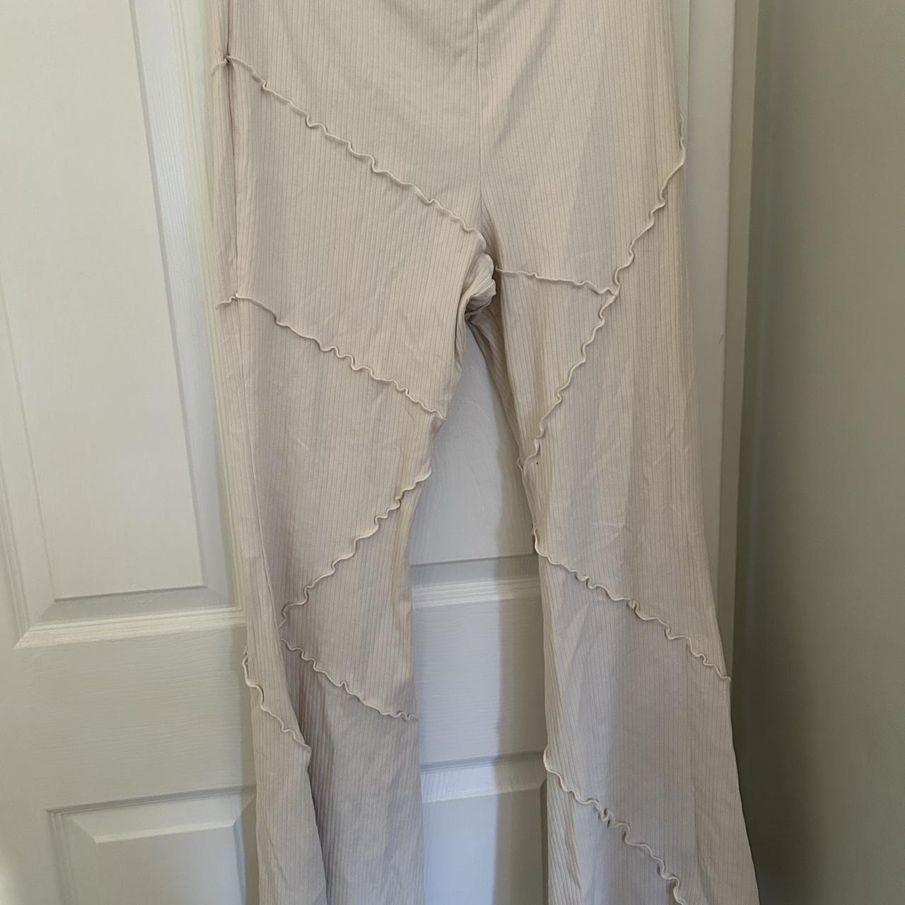 flared white ruffle pants size XL - Depop