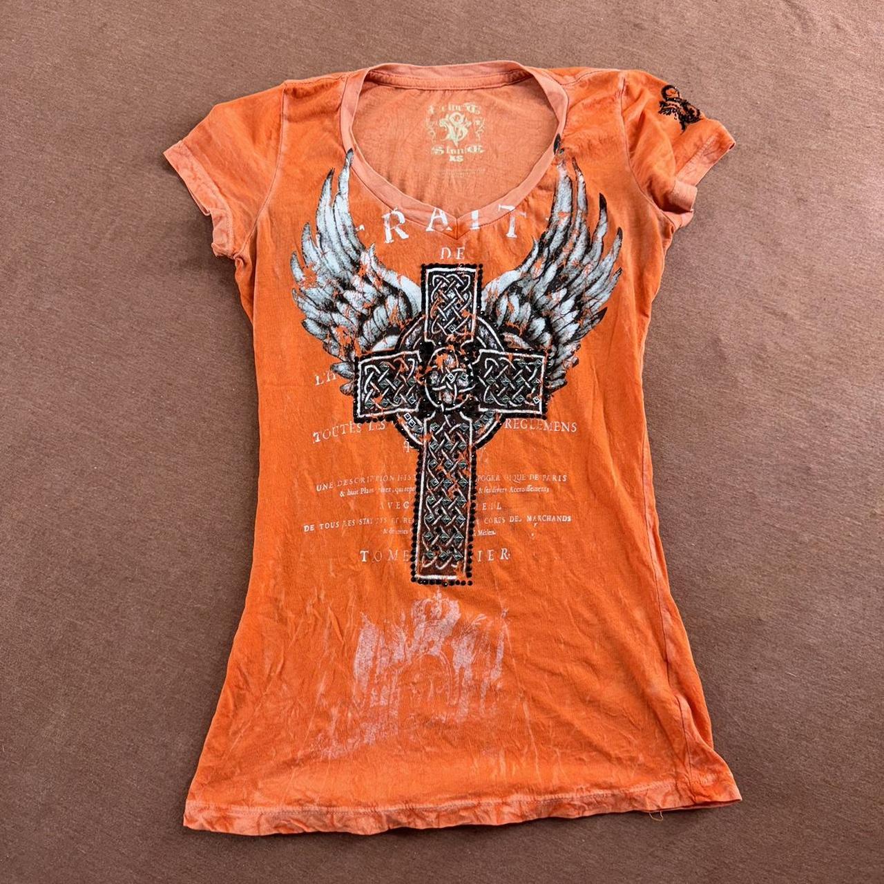 Fitted grunge tee with cross and angel wings... - Depop