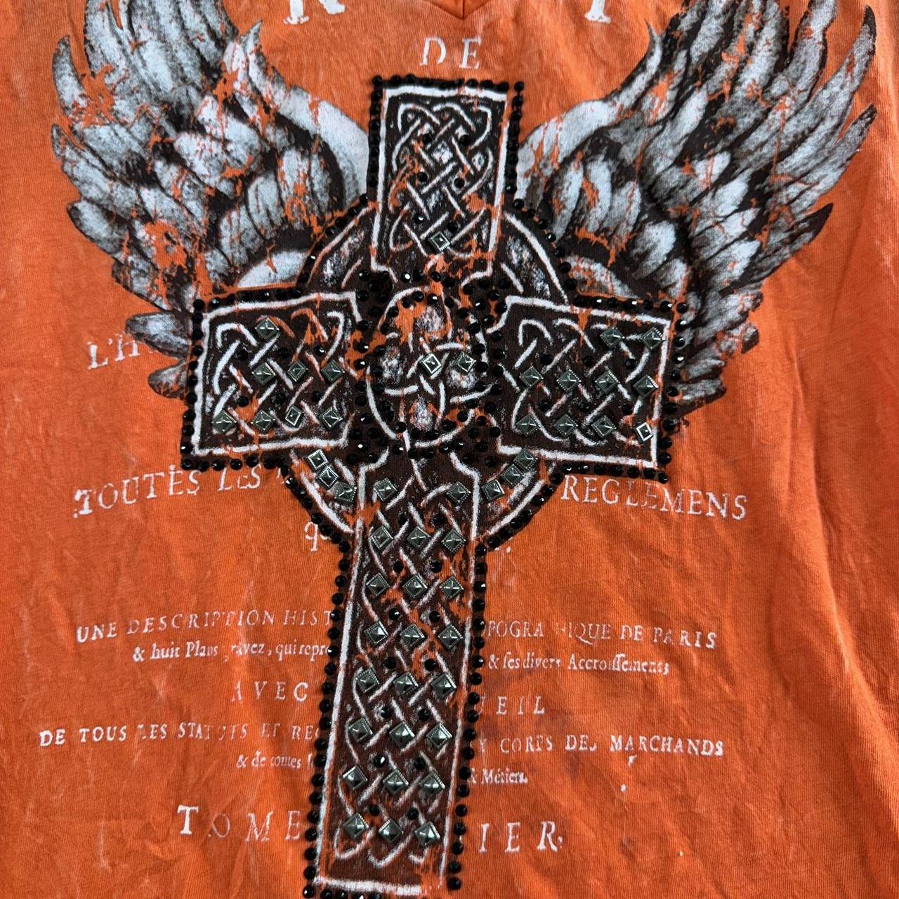 Fitted grunge tee with cross and angel wings... - Depop