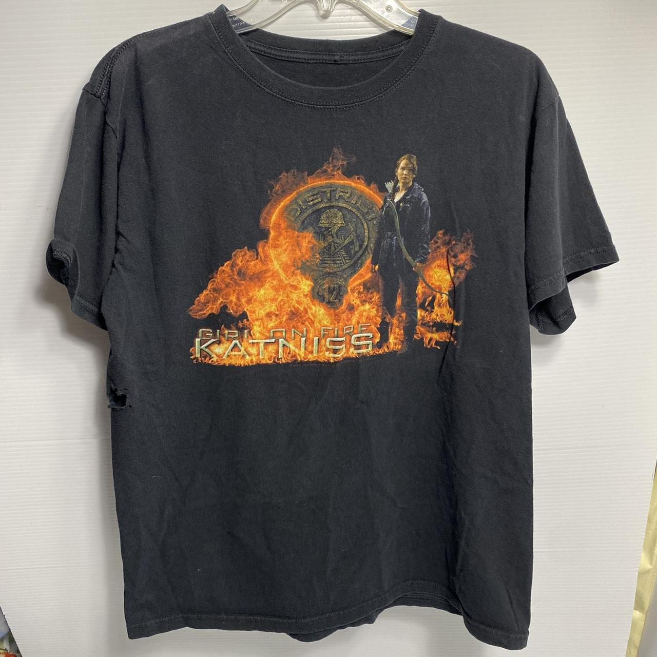 Hunger Games KATNISS ON FIRE District 12 TShirt... - Depop