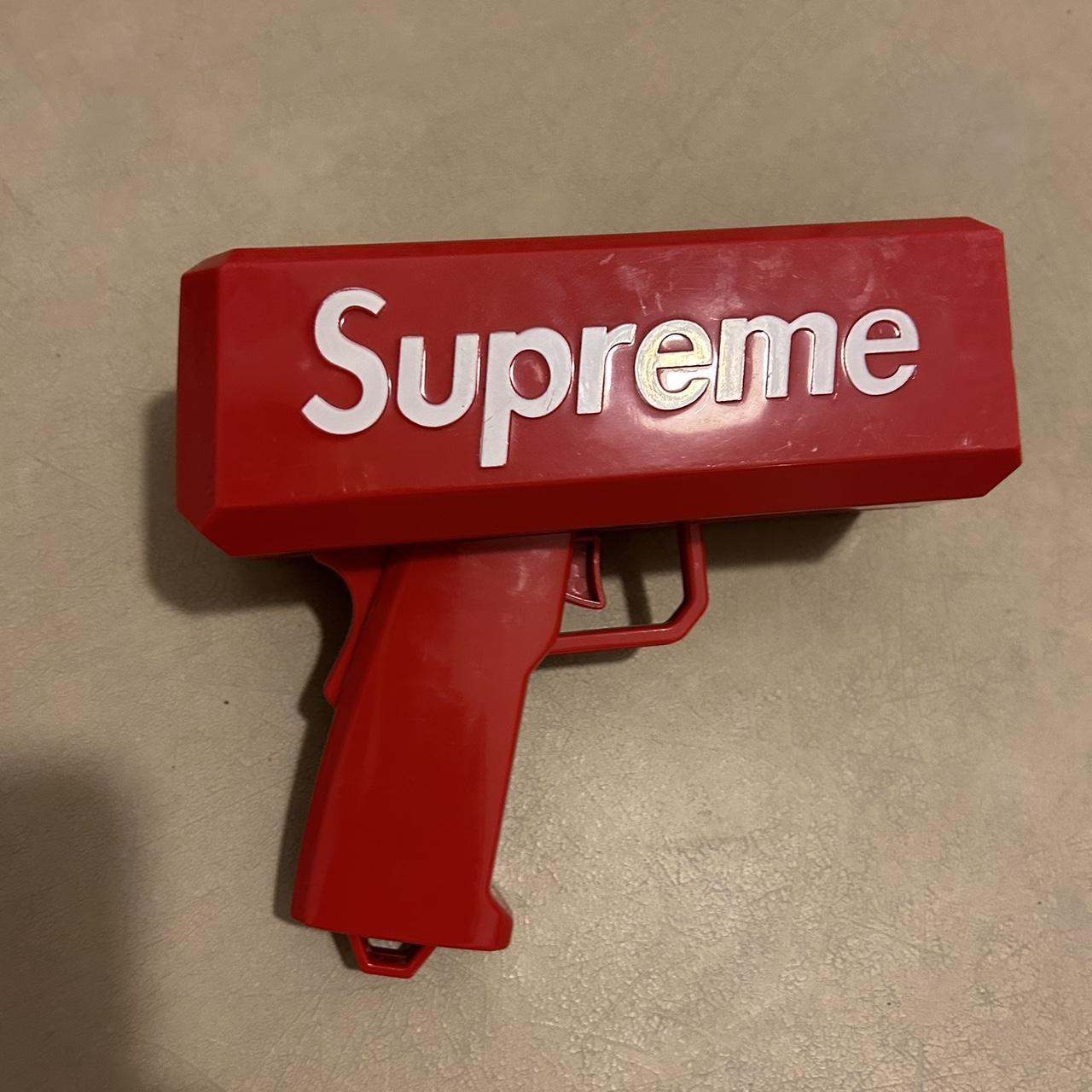 Old supreme money gun still works lost the old money... - Depop