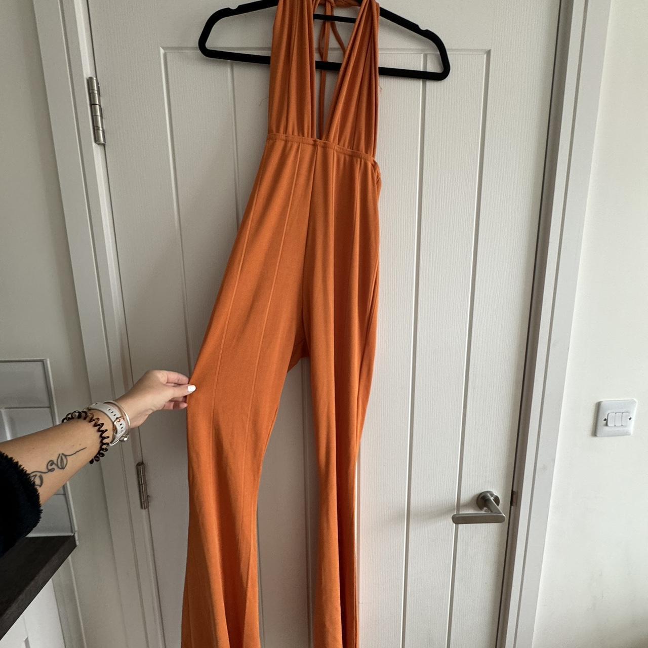 Stunning flared orange jump suit Only worn once - Depop