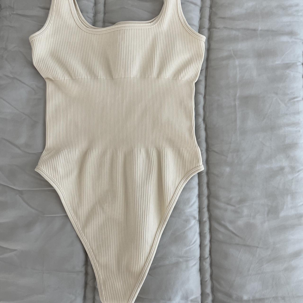 Amazon Bodysuit Color cream Ribbed, flattering... - Depop